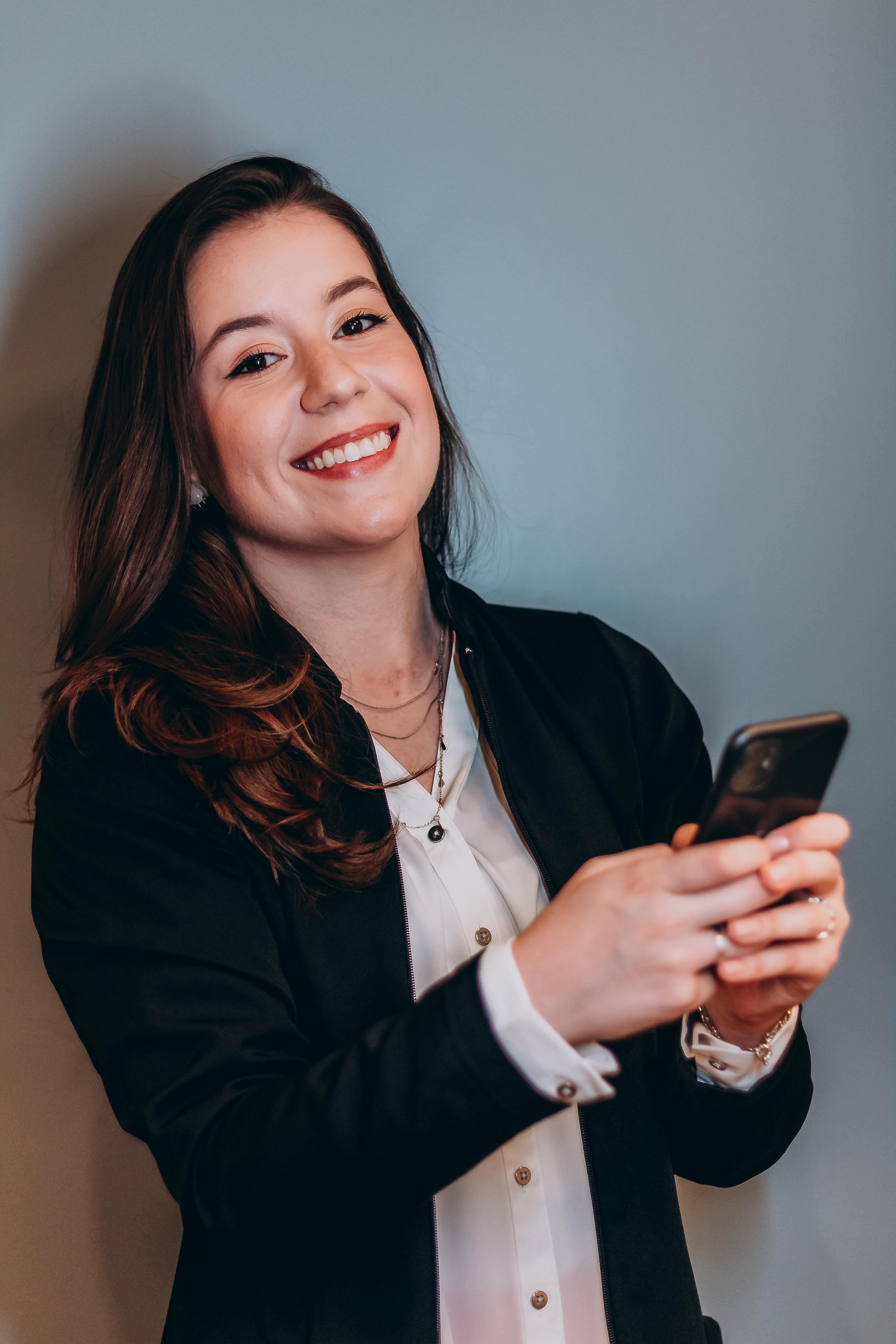 Woman in Suit Sitting on Chair in Black and White · Free Stock Photo