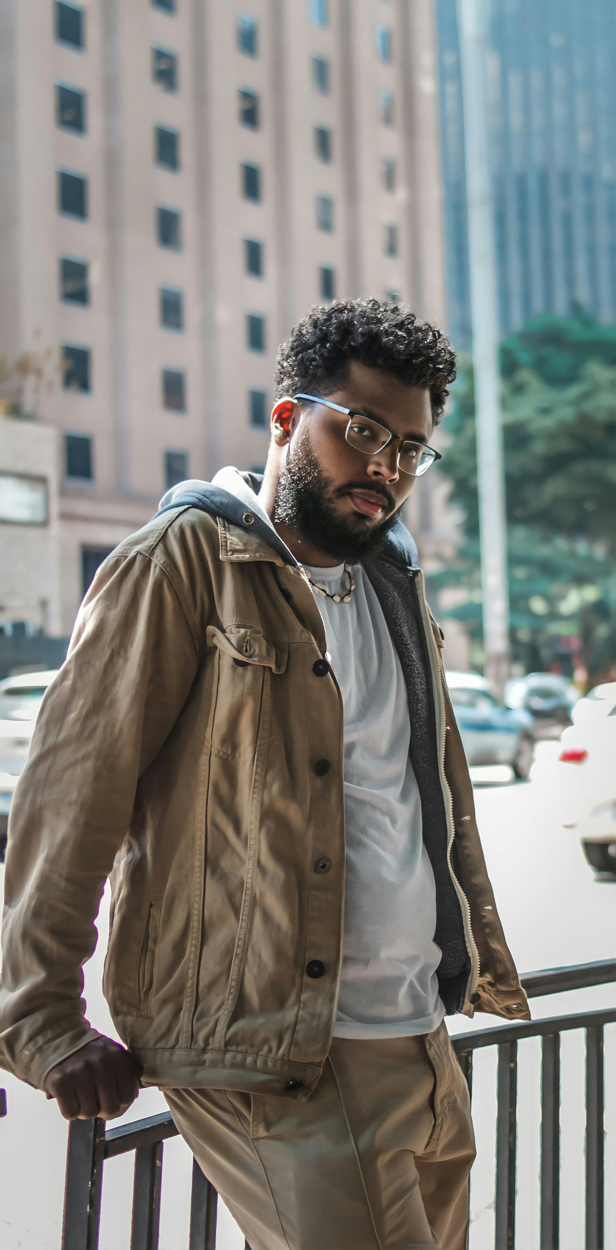 Man in Jean Jacket Posing with Leg Raised · Free Stock Photo
