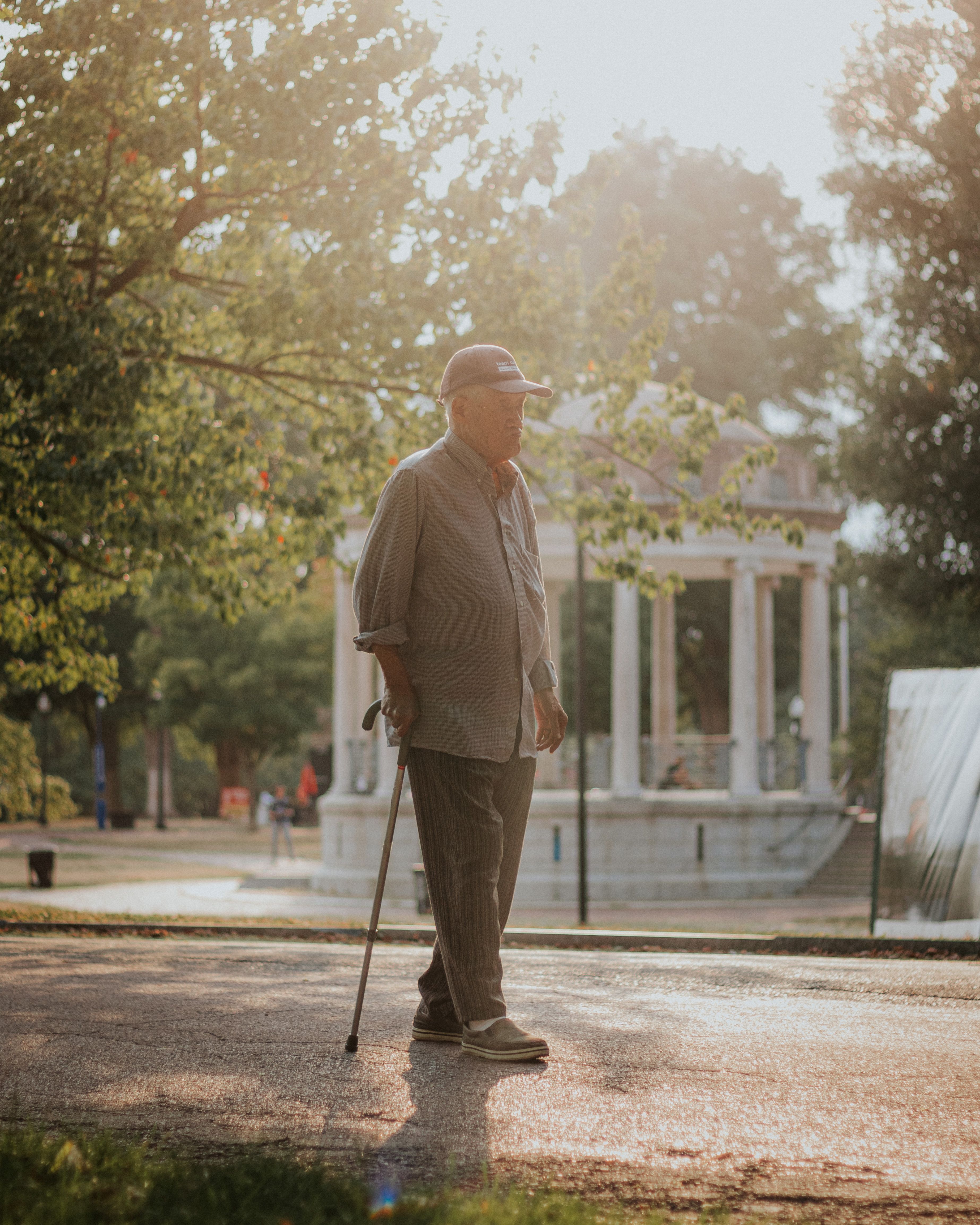 Man Walking with Walking Stick · Free Stock Photo