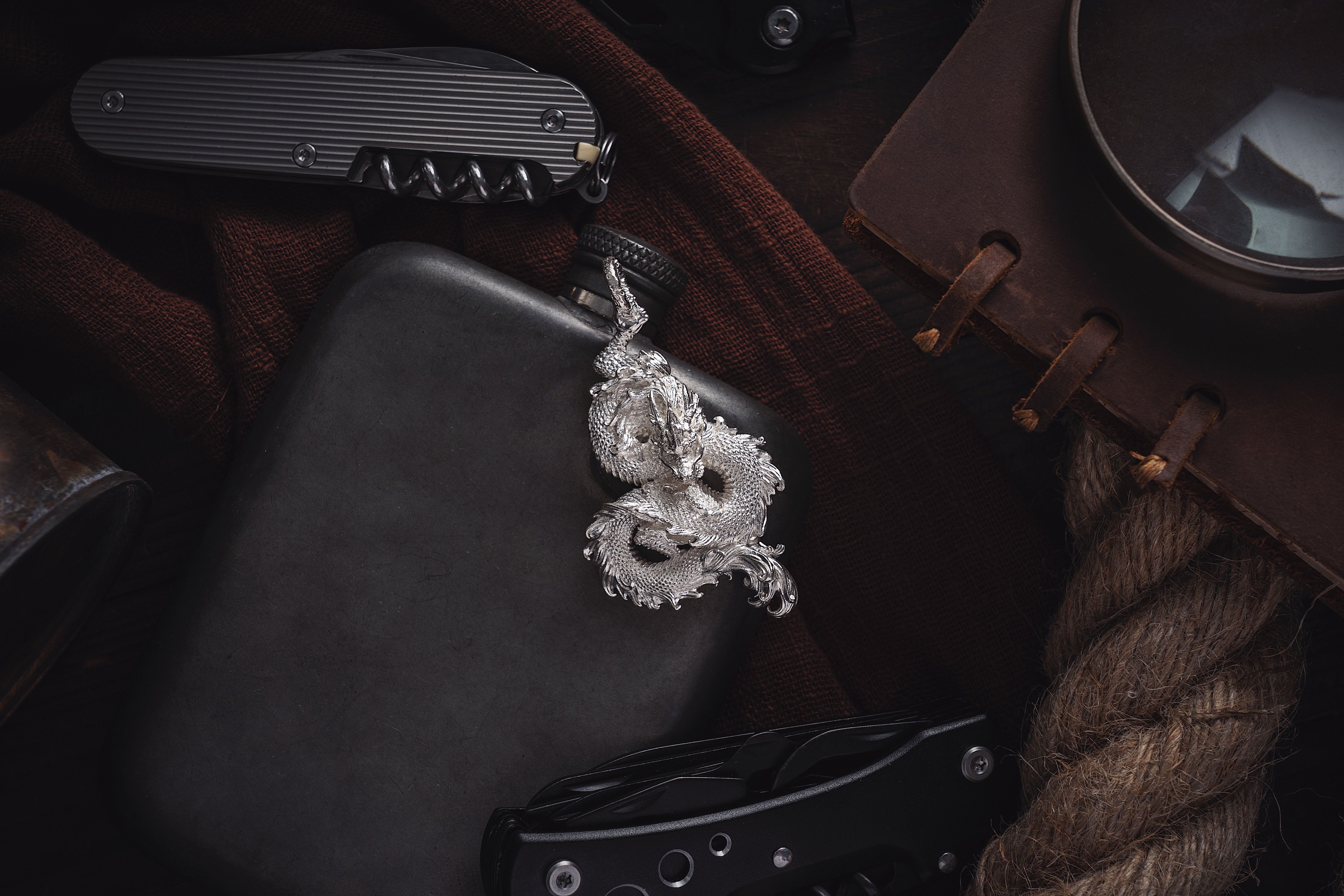 Ornamental Vintage Dragon Key Chain and a Swiss Army Knife · Free Stock ...