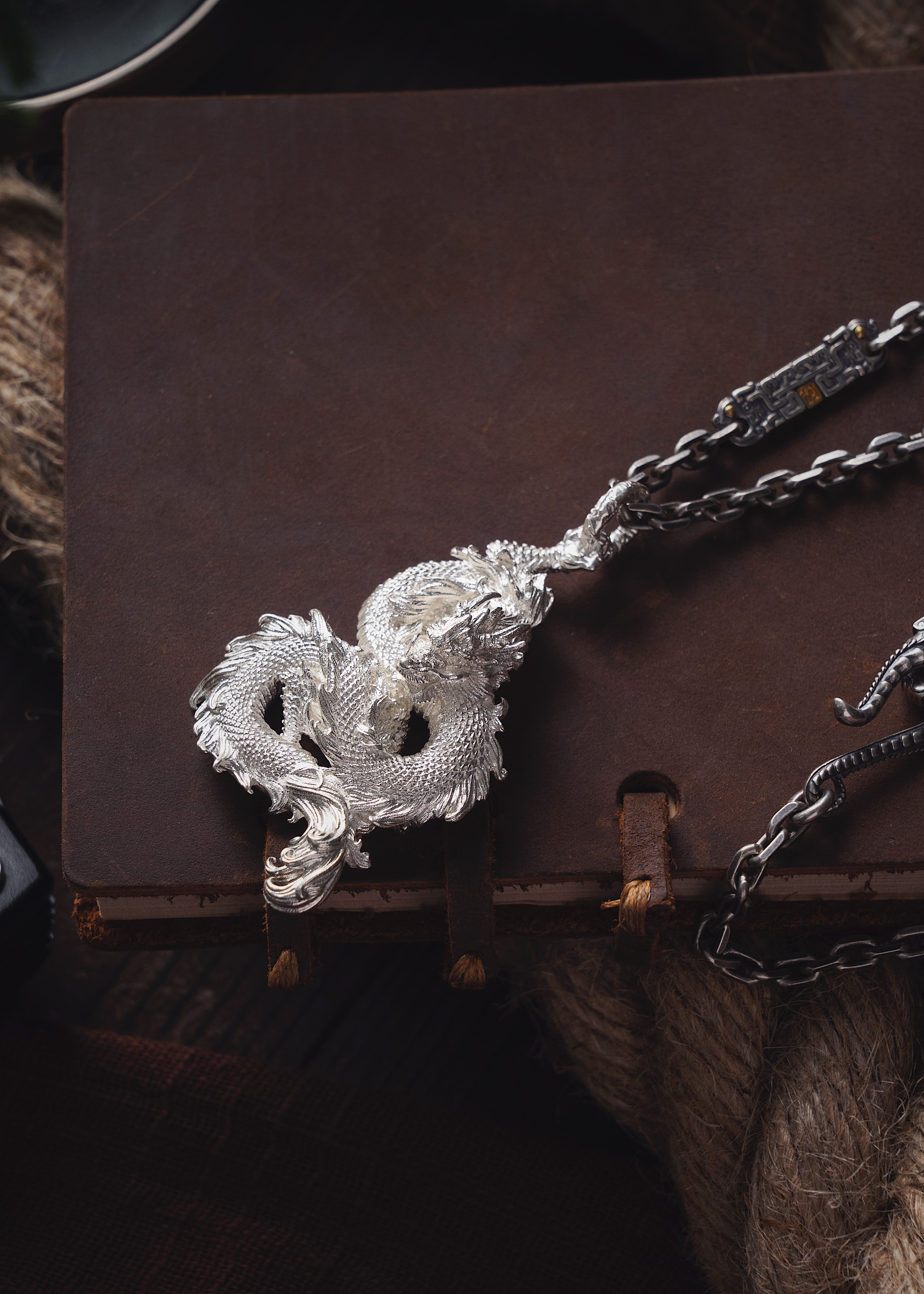 Silver Vintage Dragon on a Chain · Free Stock Photo