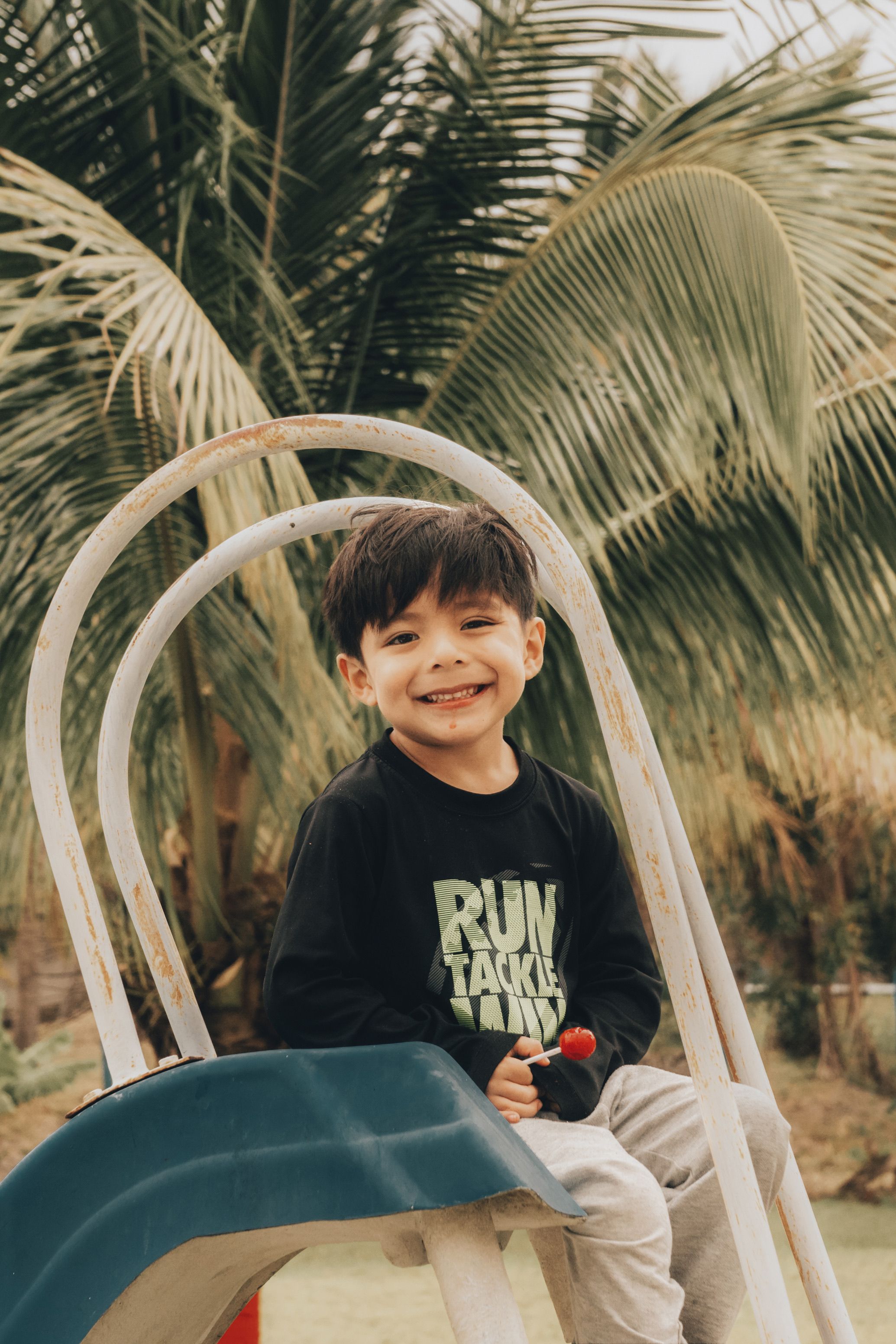 Boy Playing on Slide in Playground · Free Stock Photo
