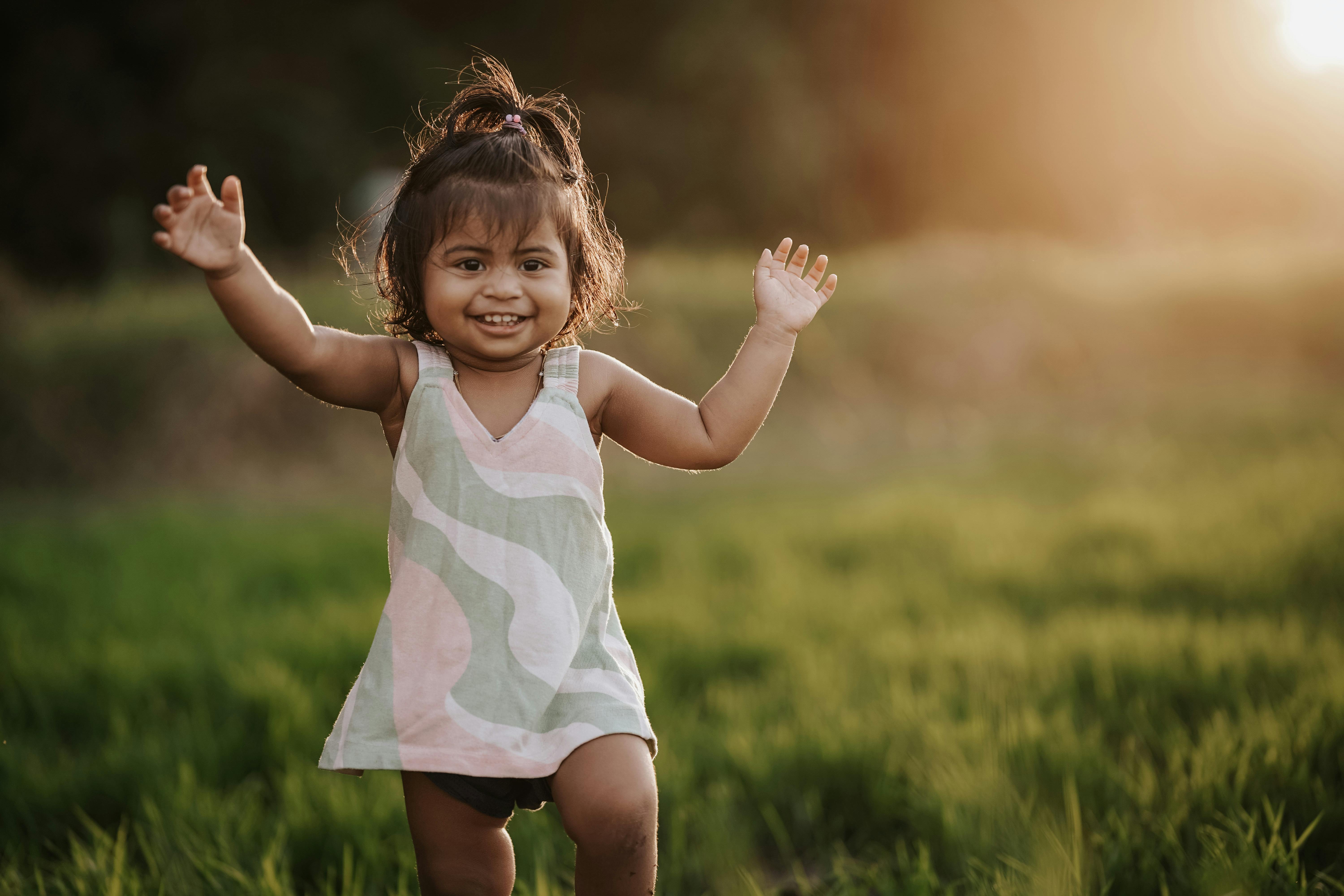 Happy Little Girl in Dress on Meadow · Free Stock Photo
