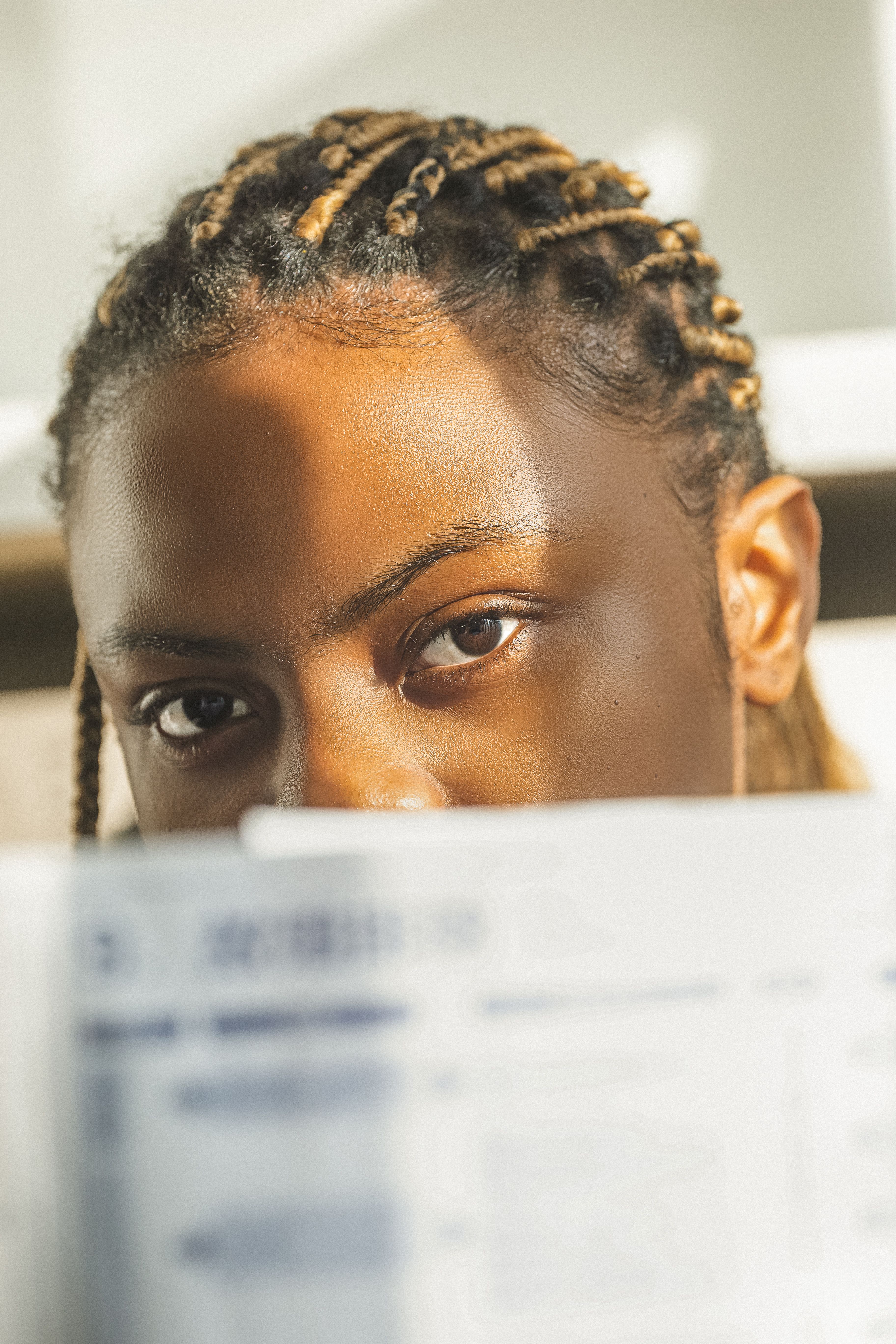 Woman Hiding behind a Newspaper · Free Stock Photo