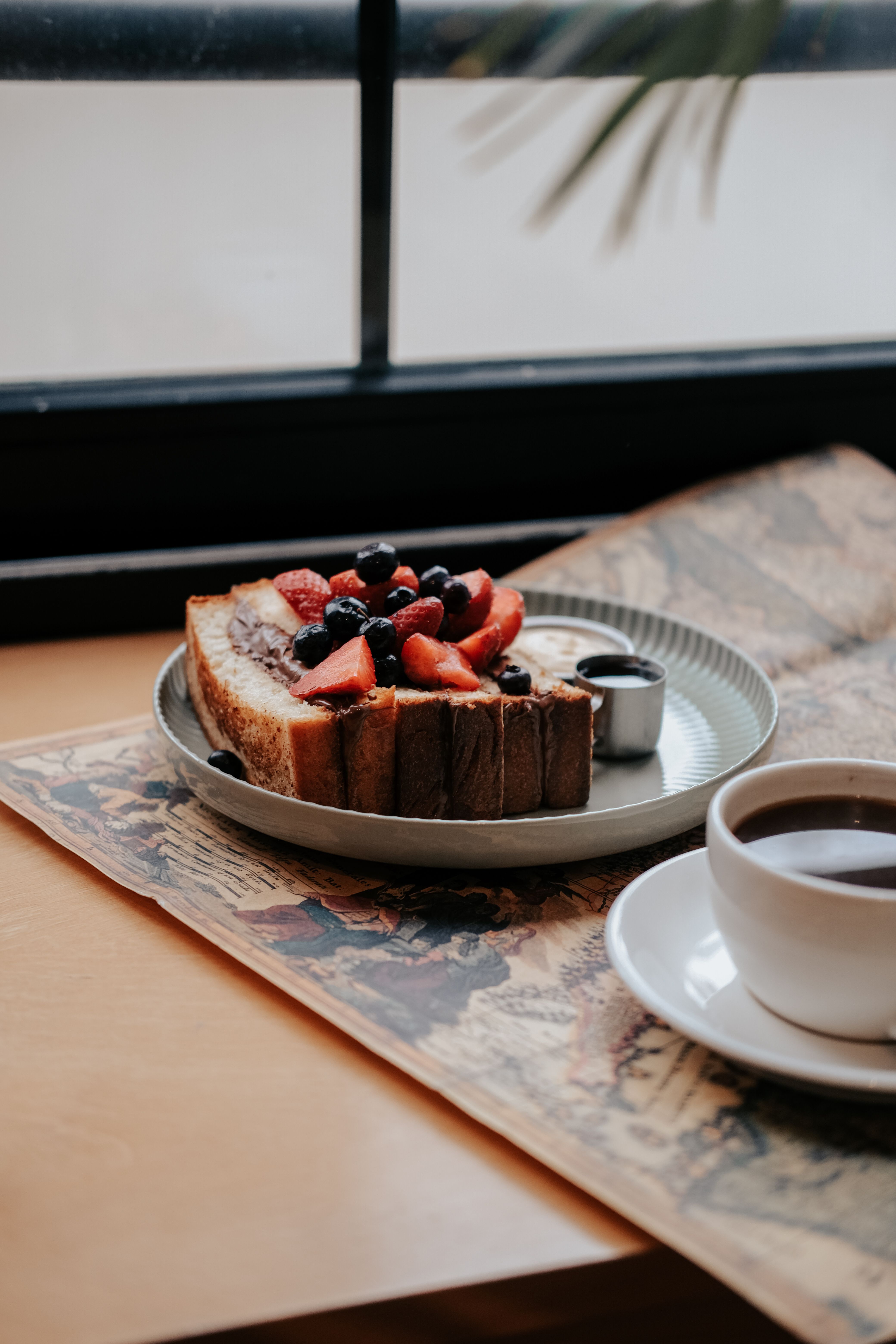 Top-view Photograph of Two Cupcakes, Cup, and Eyeglasses · Free Stock Photo