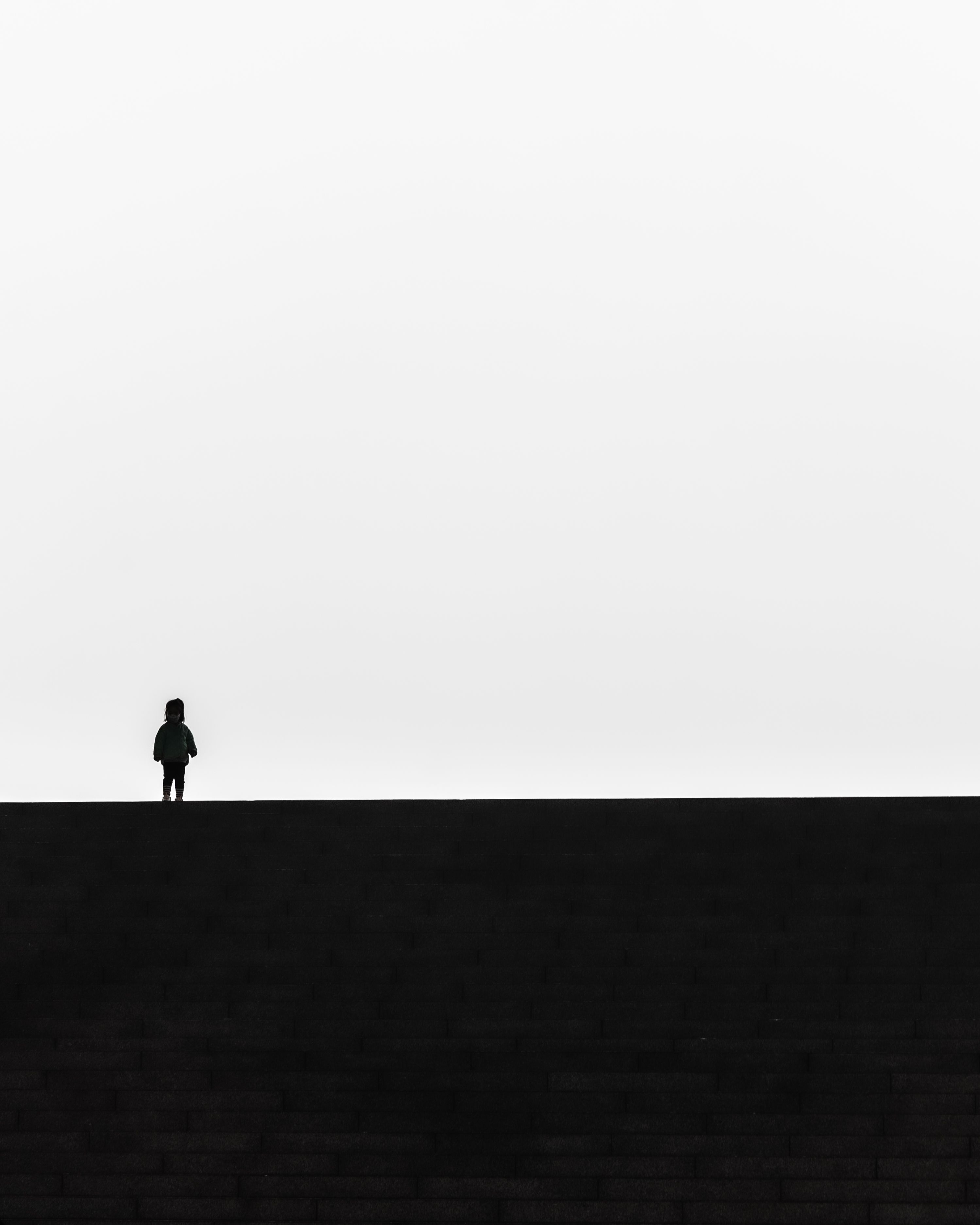 Silhouette of a Child Standing in Distance · Free Stock Photo