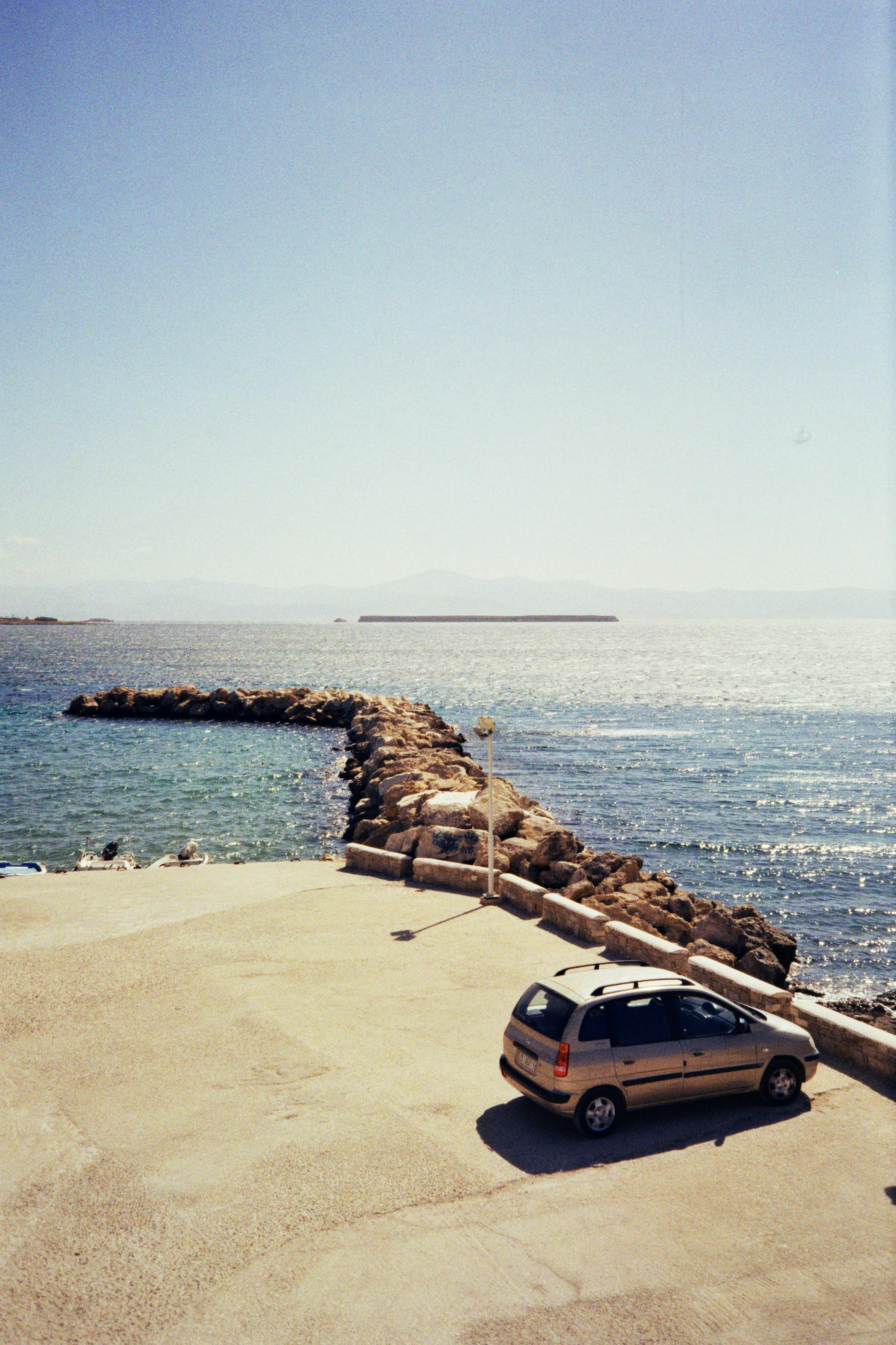 Car Parked on Sea Shore · Free Stock Photo
