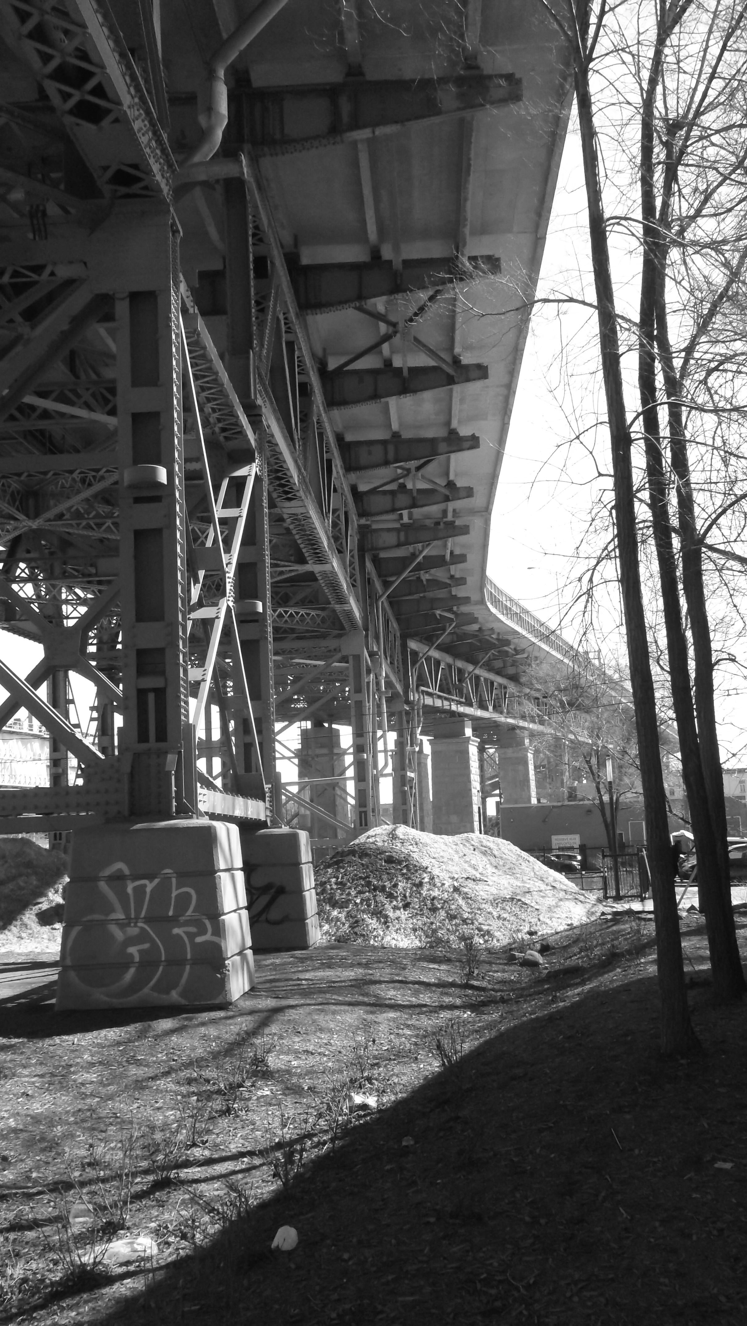Black and White Photograph of a Road under a Viaduct · Free Stock Photo