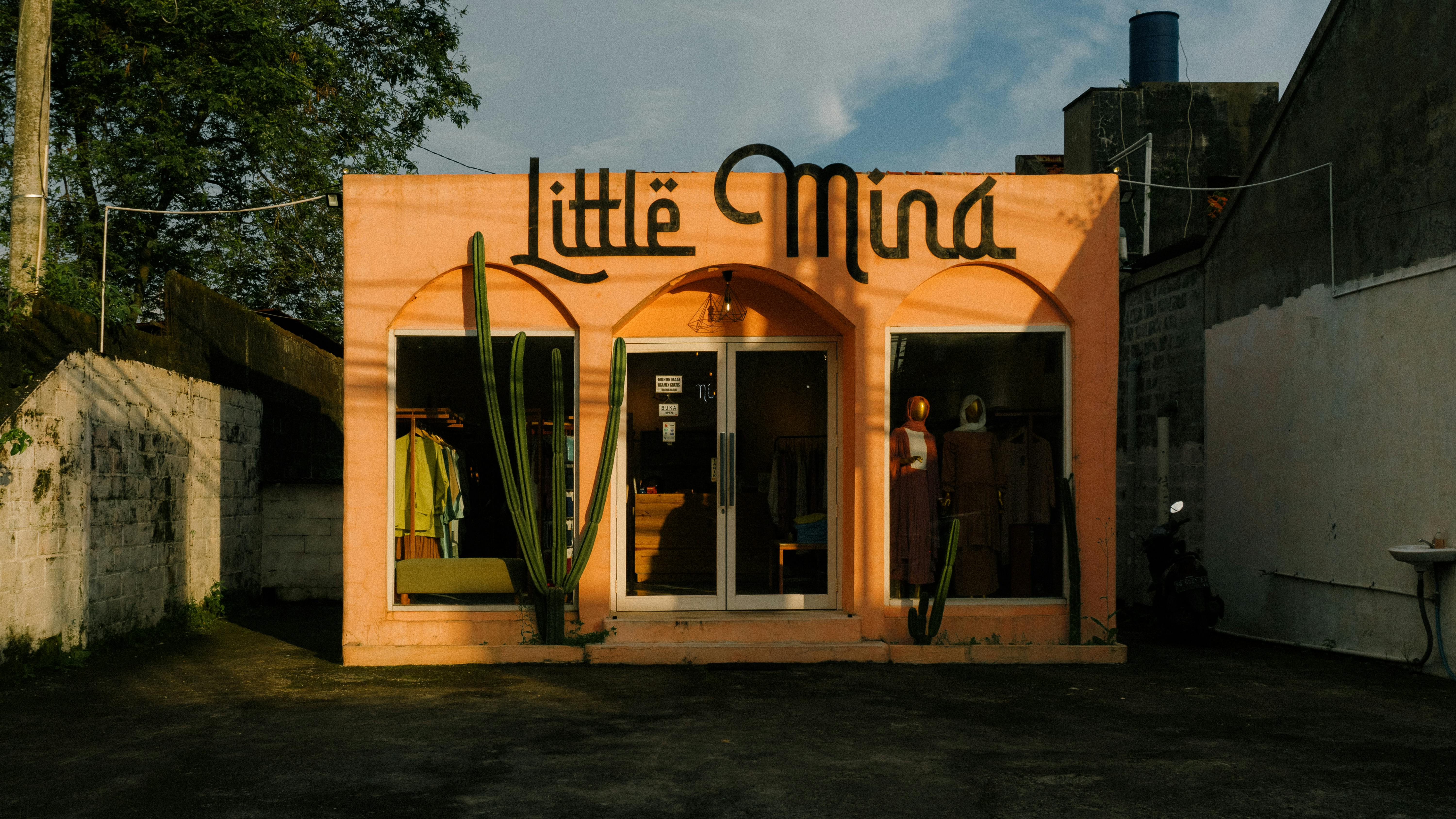 Exterior of a Small Clothing Store in City · Free Stock Photo