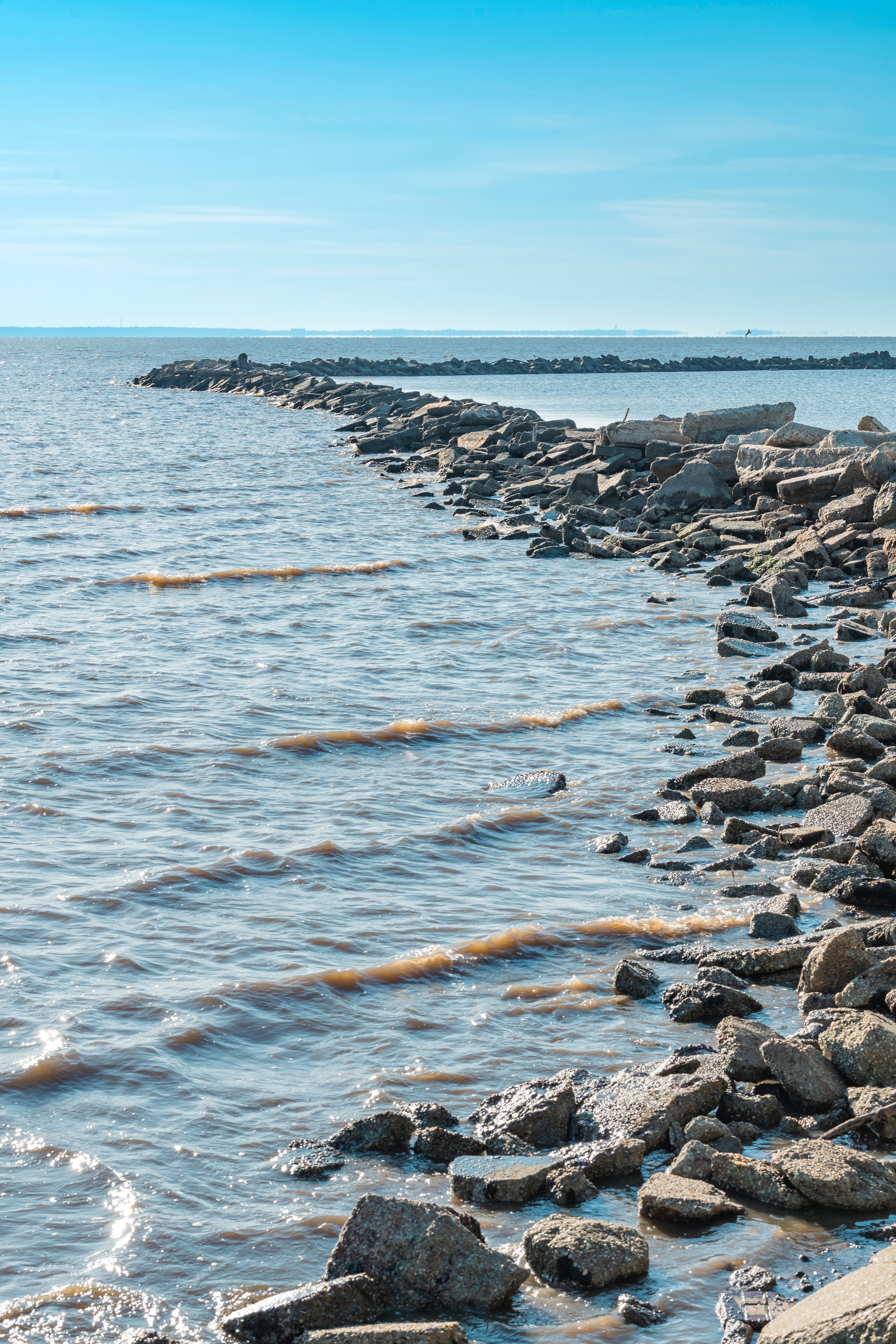 Seascape with Rocky Breakwater · Free Stock Photo