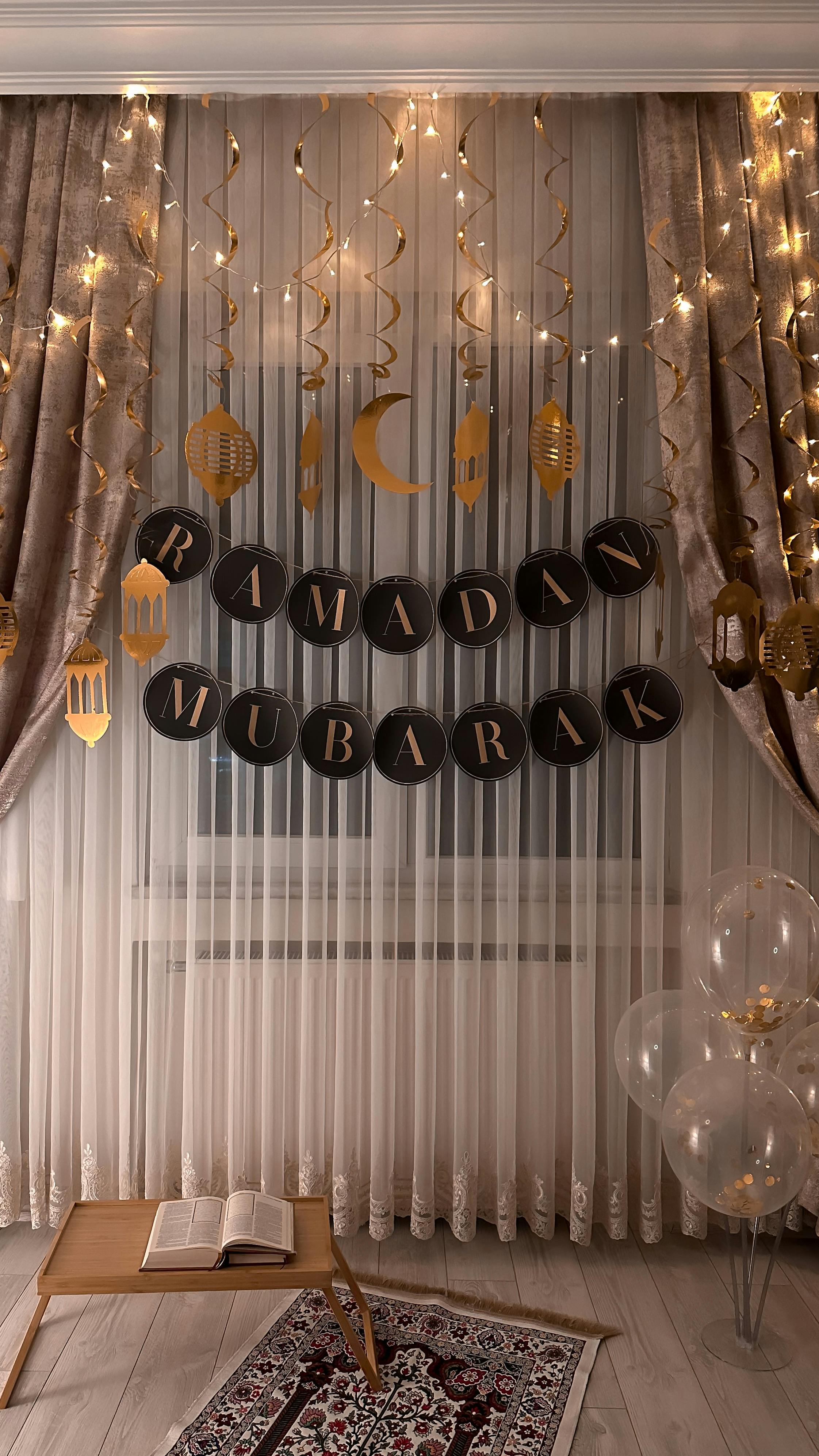 Window Decorated for Ramadan and a Stand with the Quran · Free Stock Photo