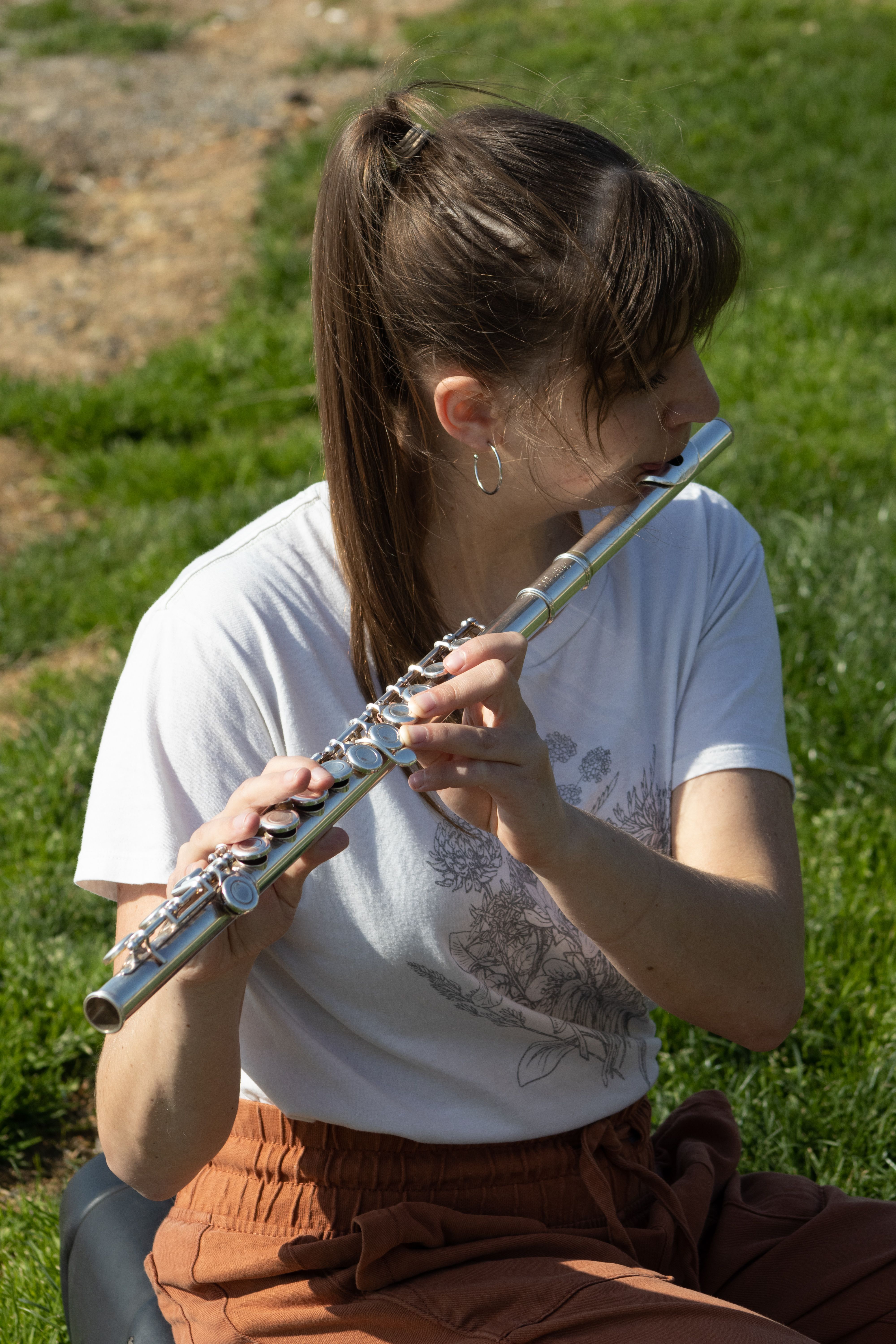 Woman Playing Western concert flute · Free Stock Photo