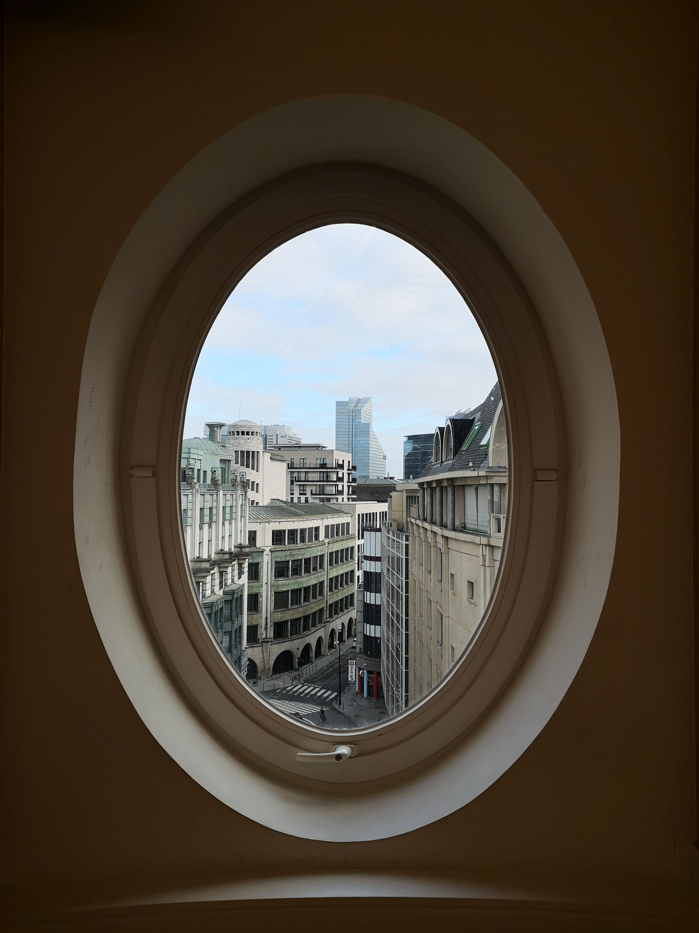 Oval Window with City View · Free Stock Photo