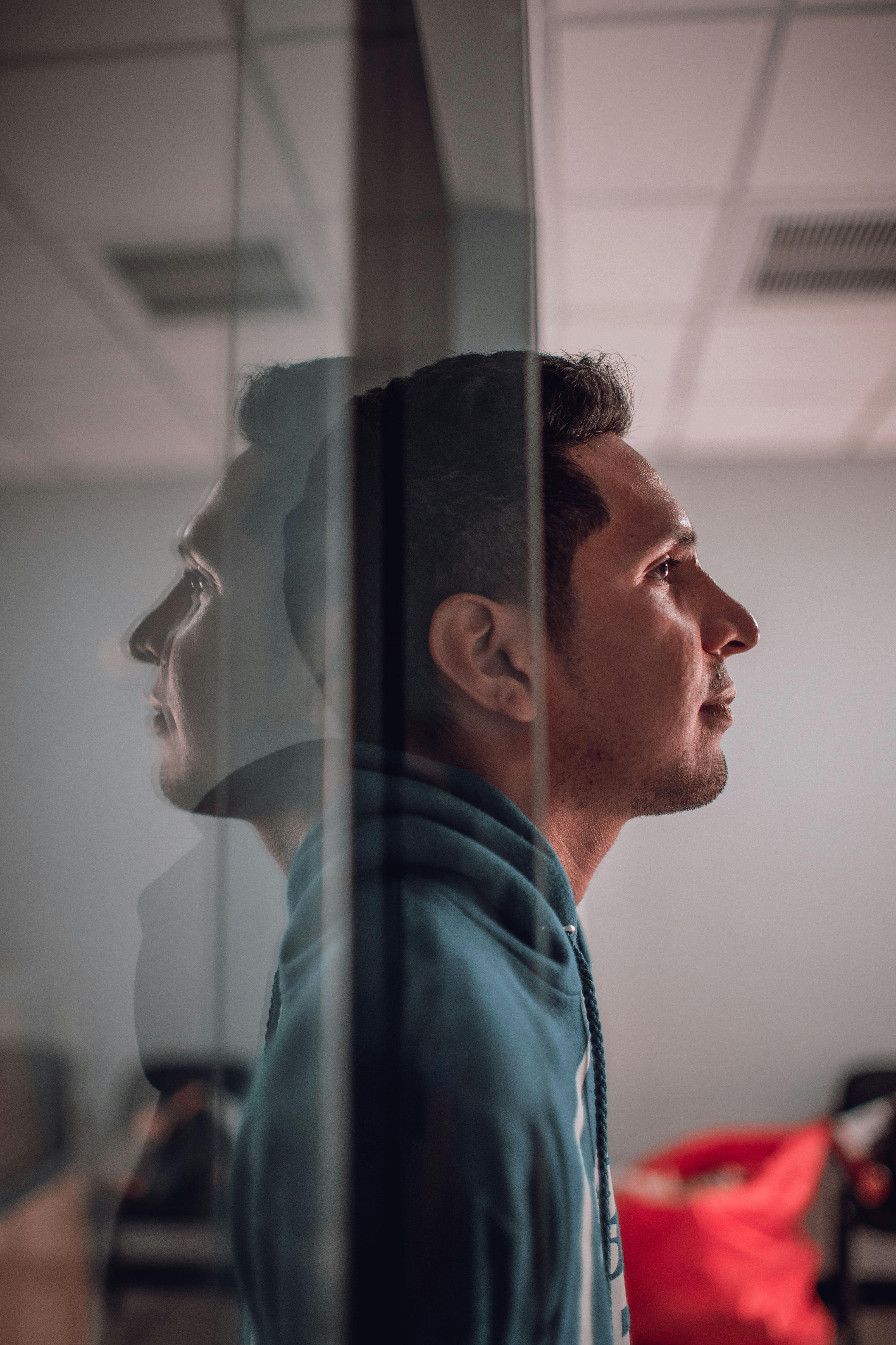 Man Leaning on Wall · Free Stock Photo