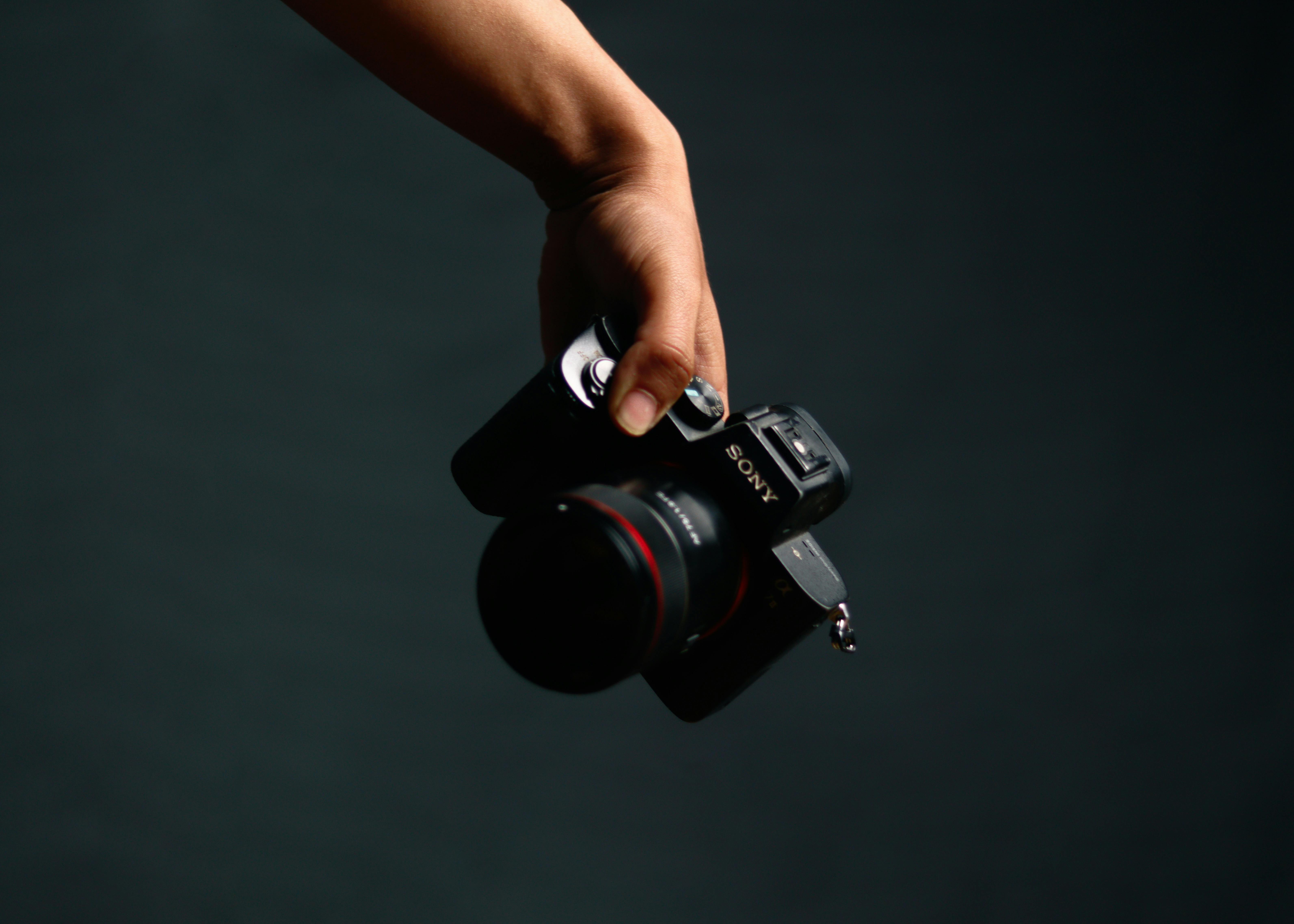 Hand Holding Camera · Free Stock Photo