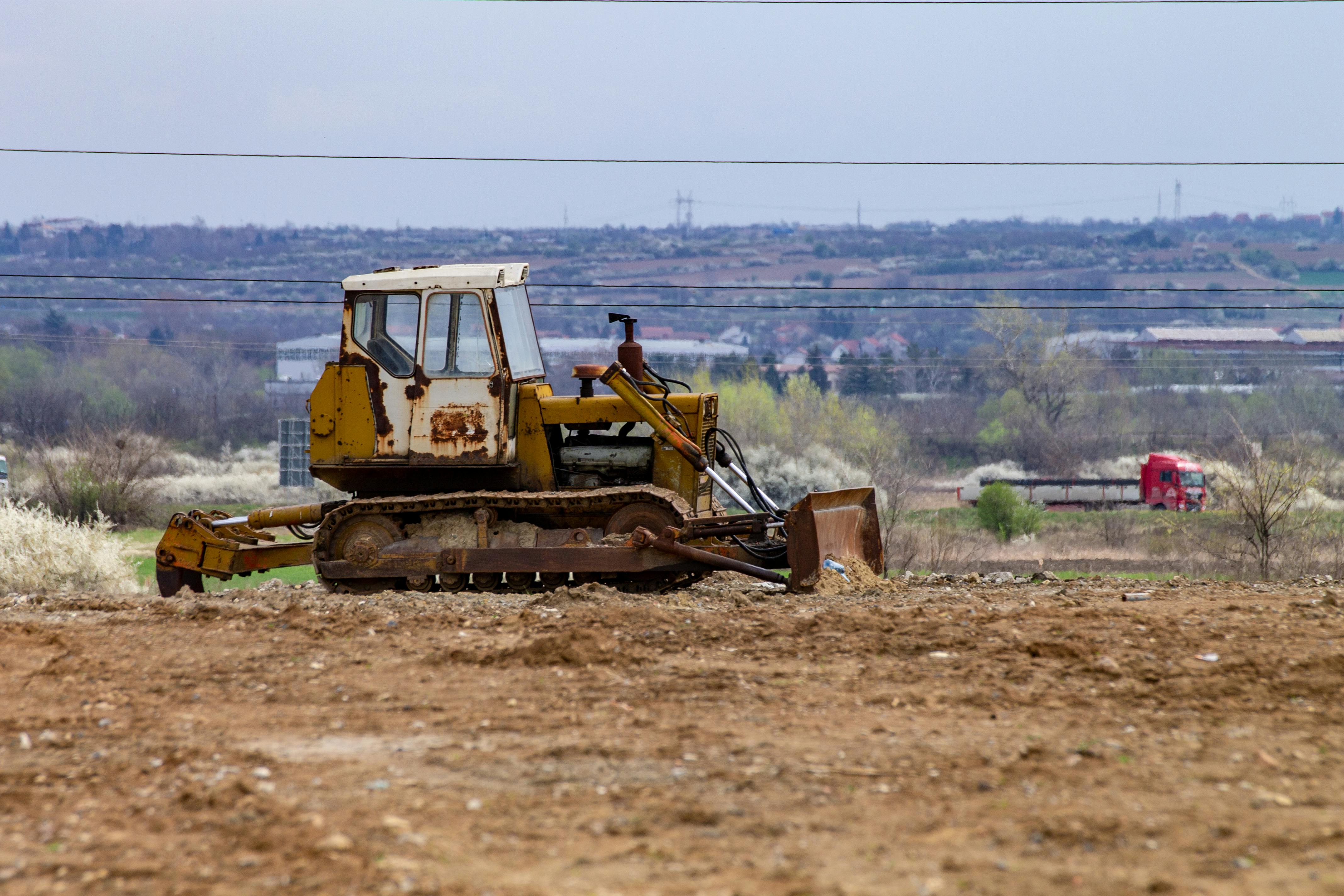 A Bulldozer on a Field · Free Stock Photo