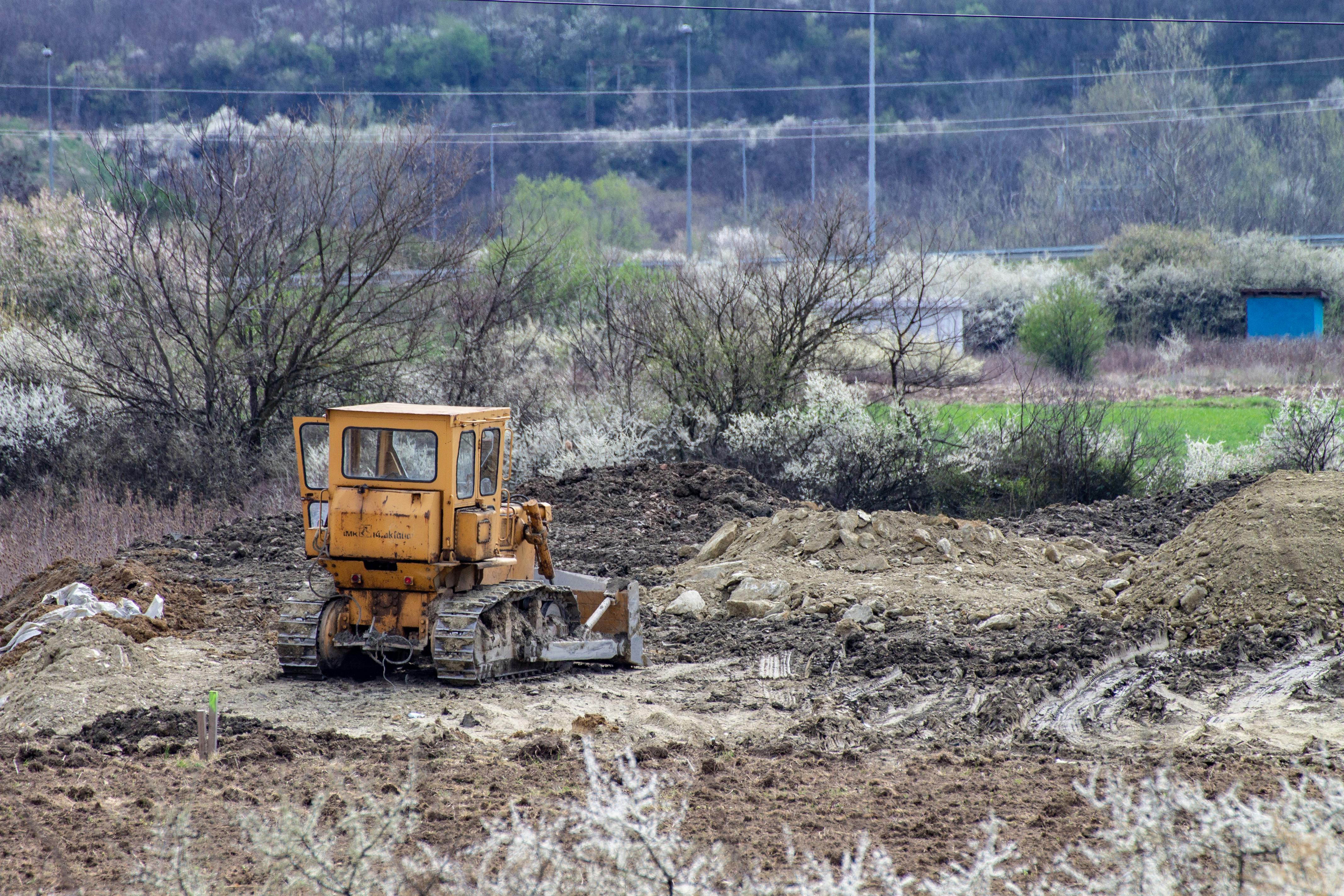 A Bulldozer on a Field · Free Stock Photo