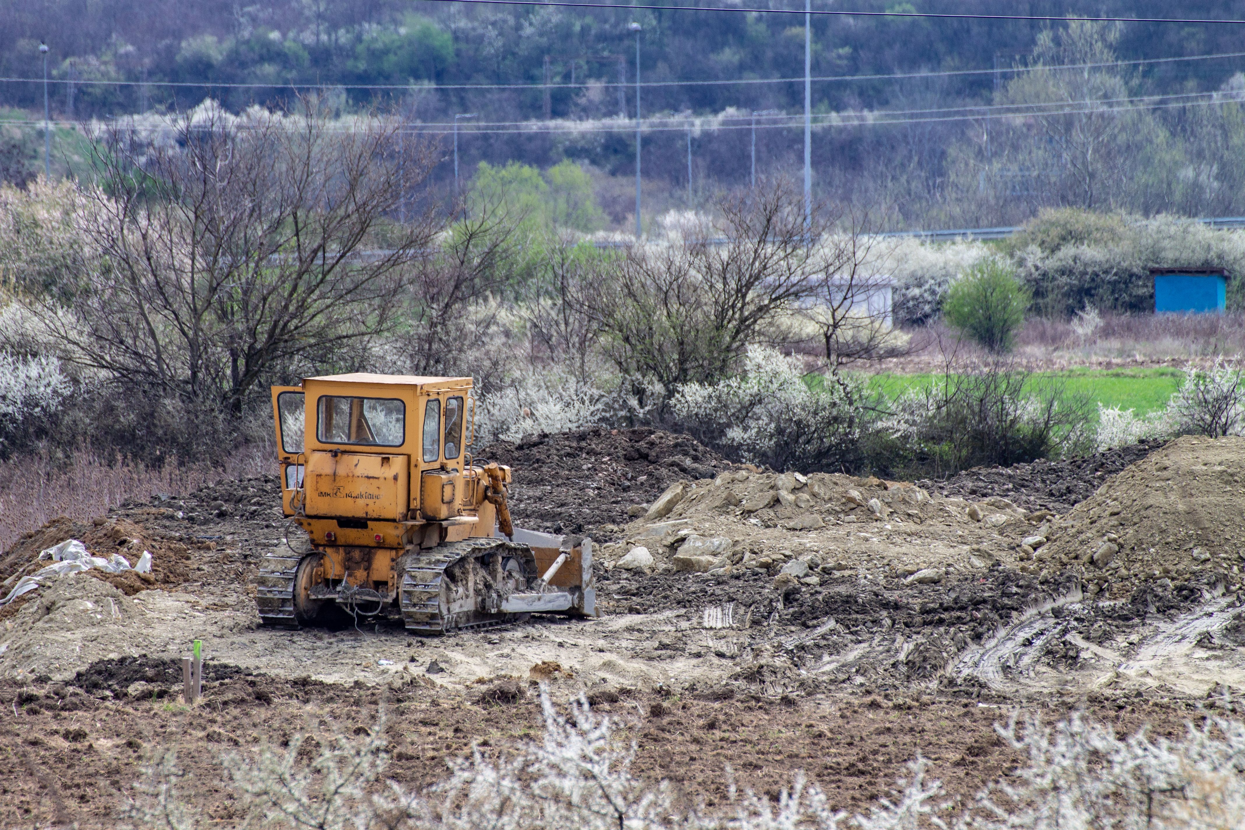 A Bulldozer on a Field · Free Stock Photo