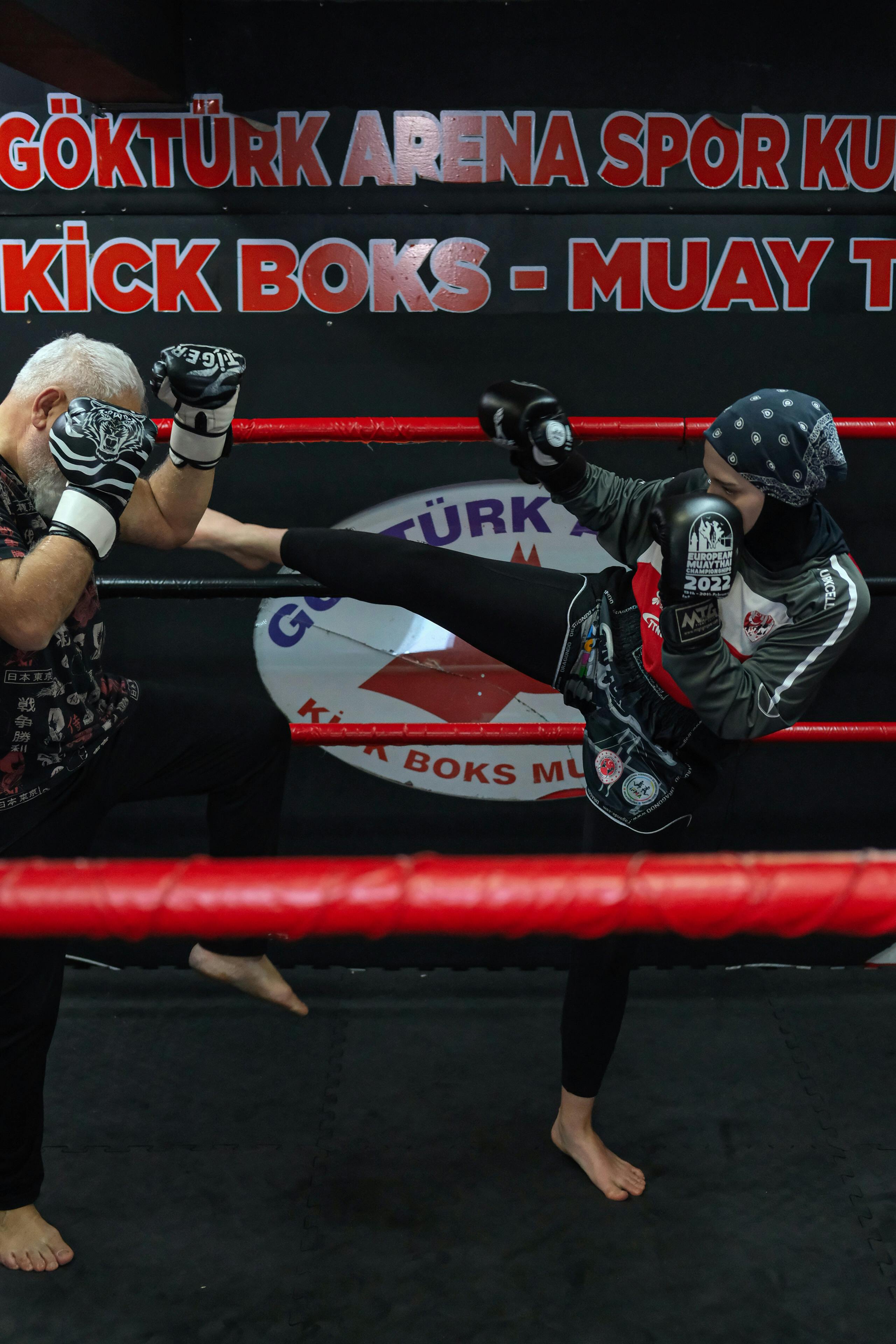 Two men kickboxing in a gym · Free Stock Photo