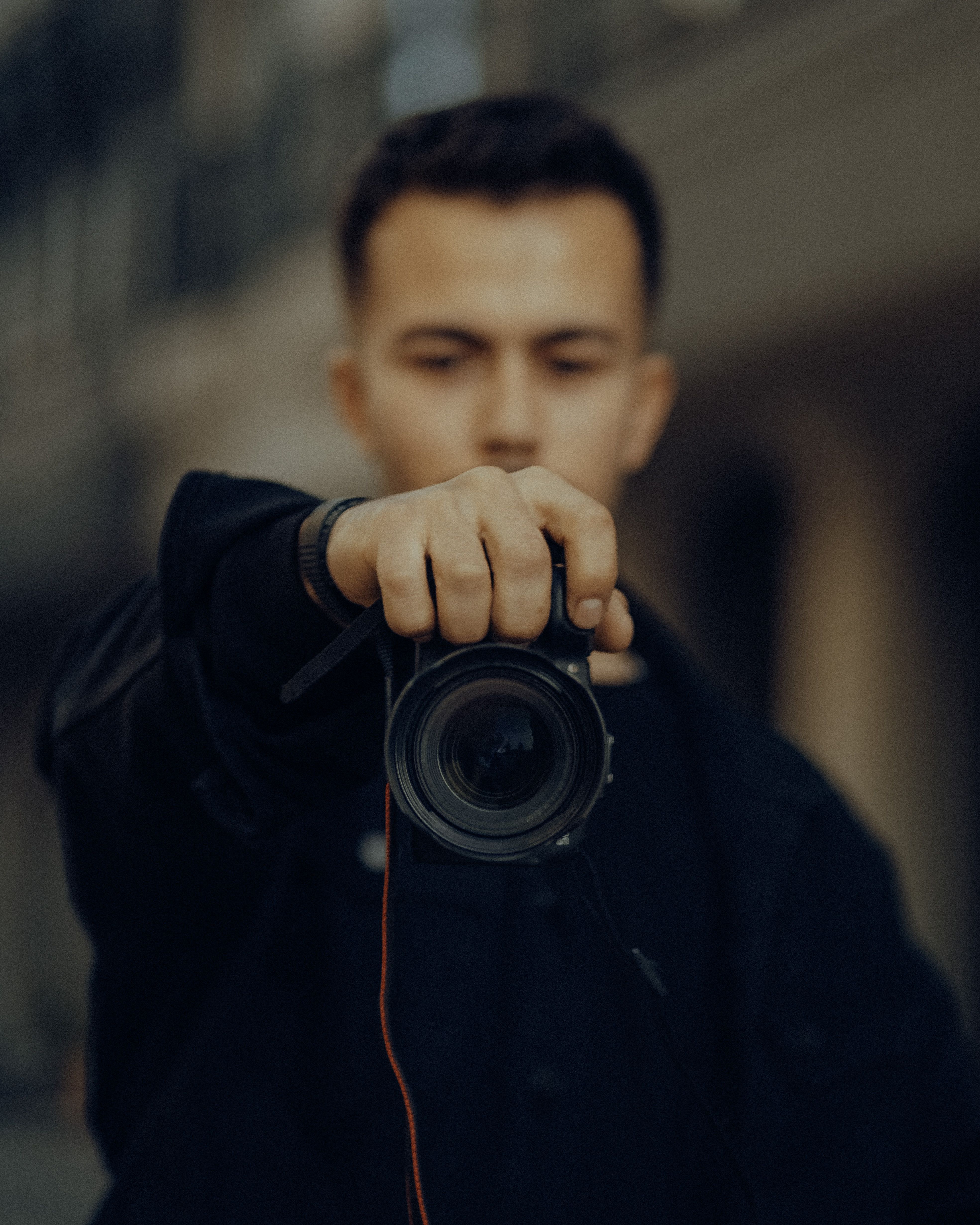 Man With Camera Between His Hands · Free Stock Photo