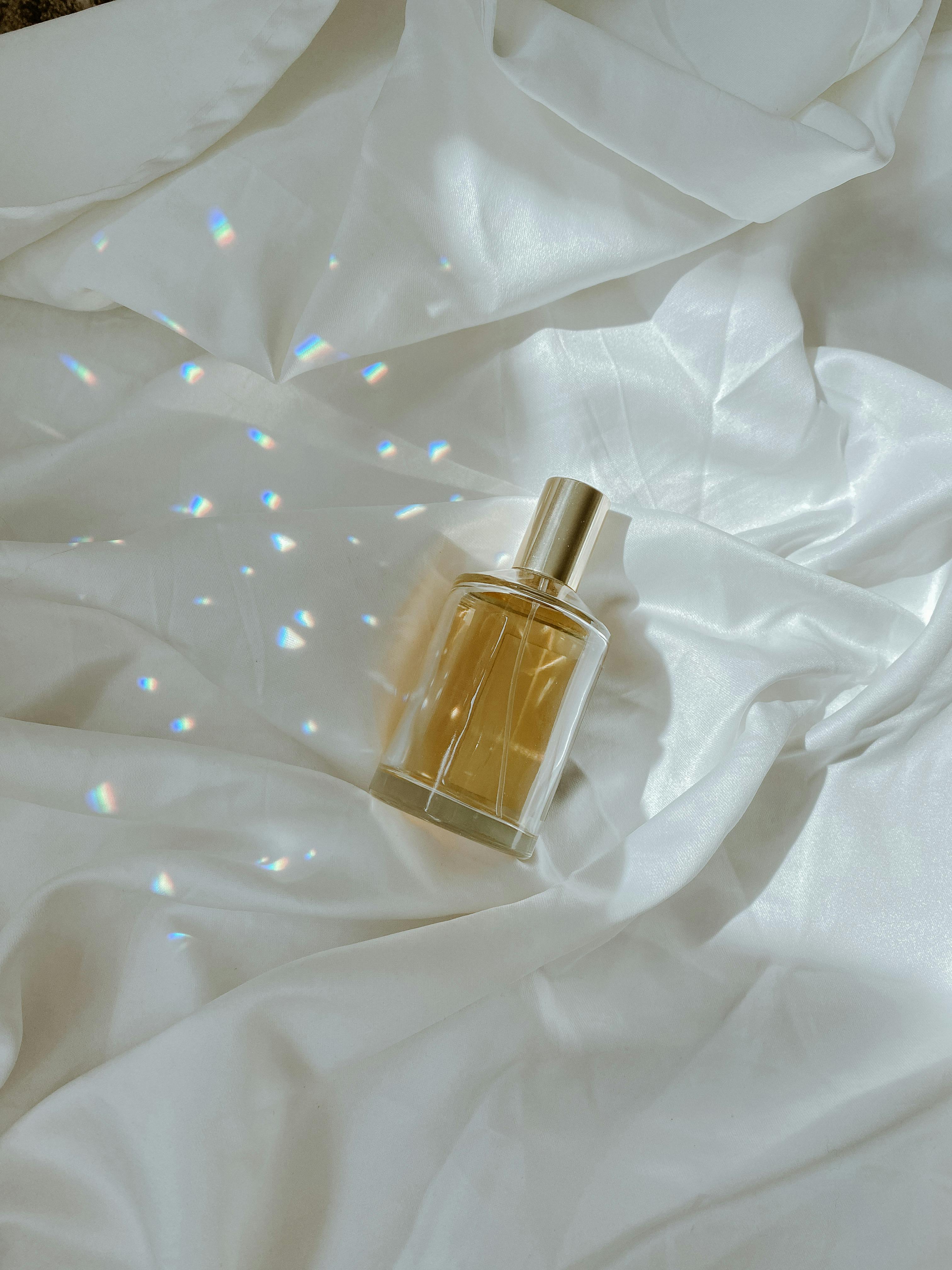Vial of Perfume on Traditional Carpet · Free Stock Photo