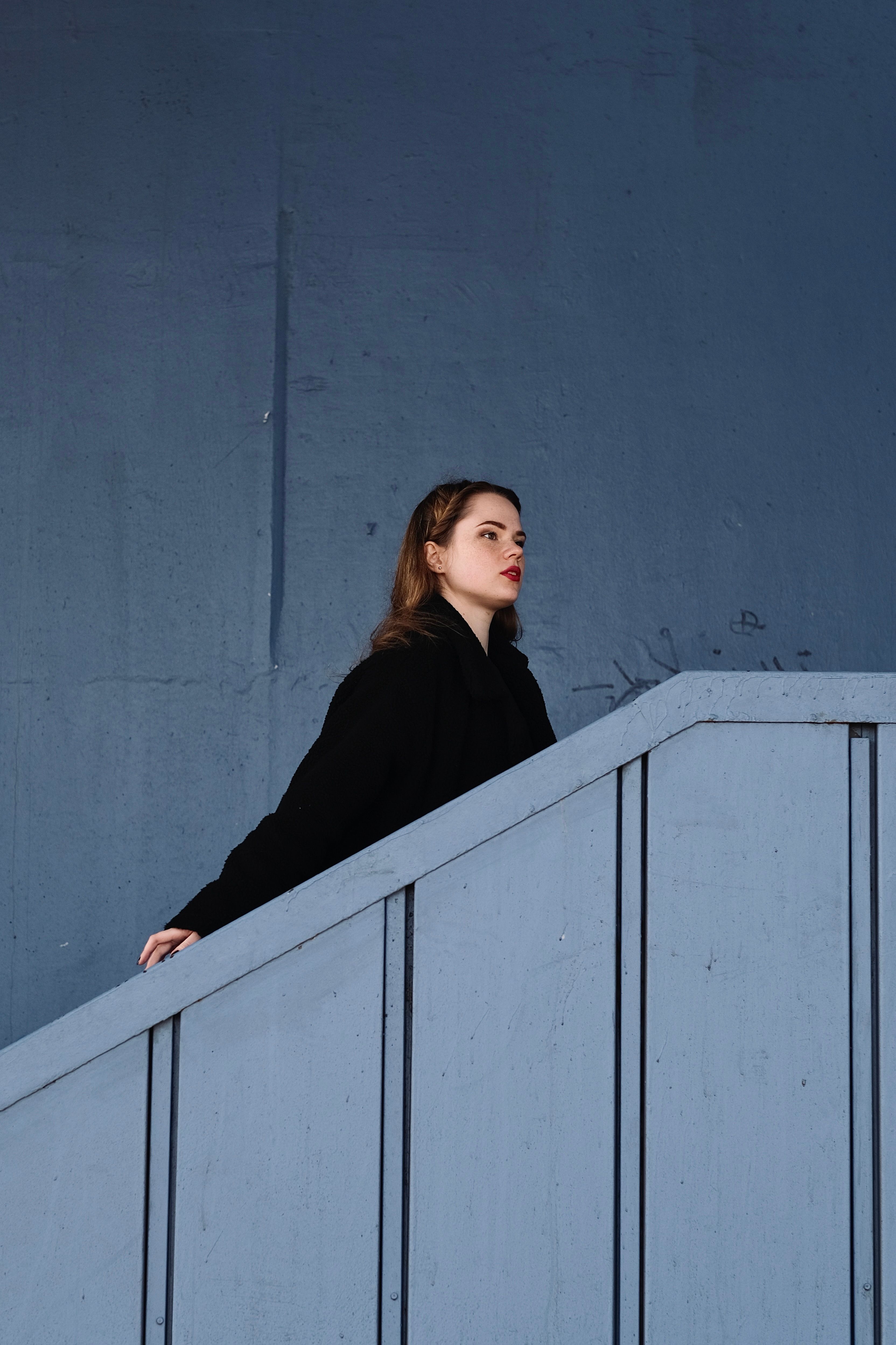 Woman Standing on Stairs and Posing · Free Stock Photo