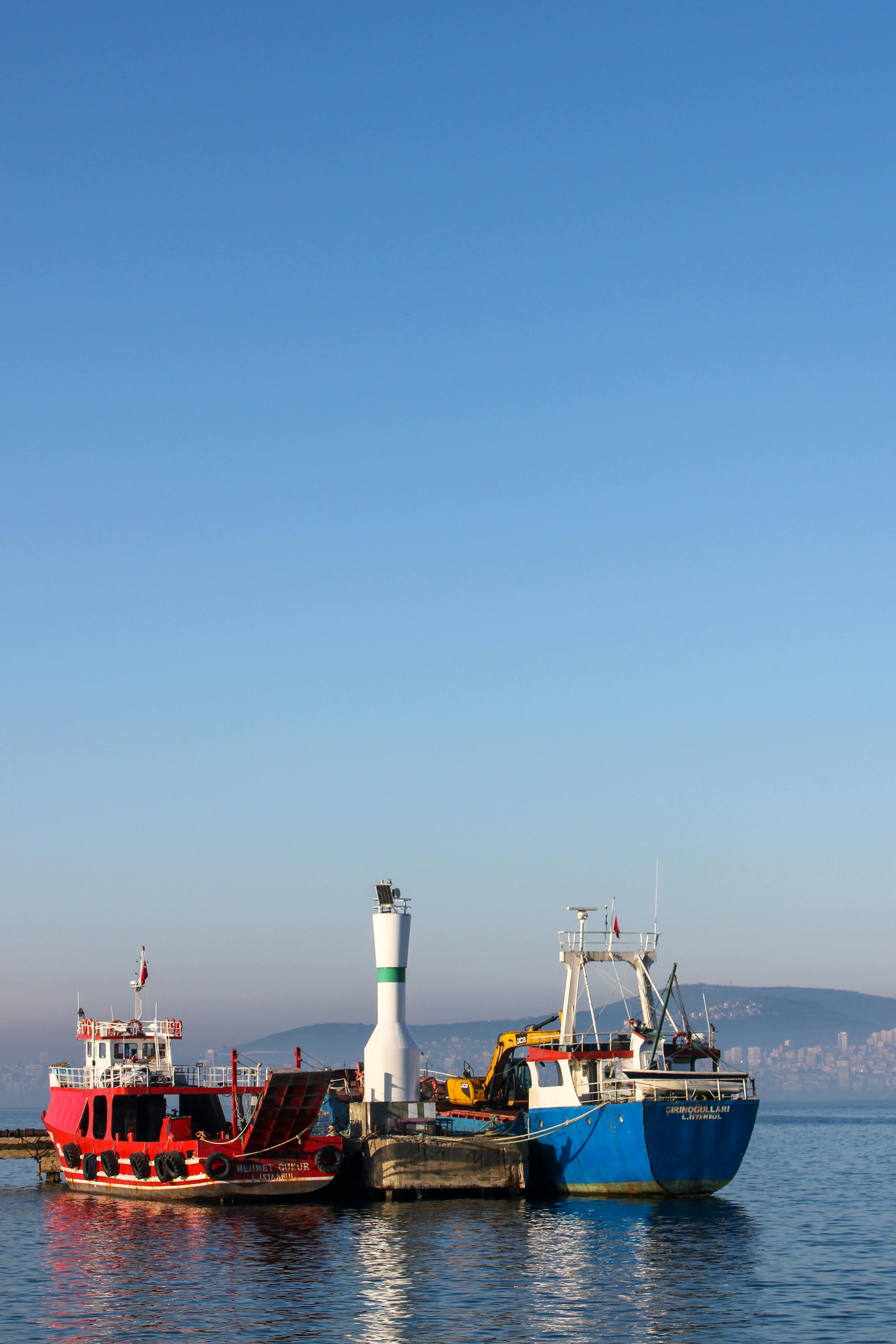 Clear Sky over Moored Trawlers · Free Stock Photo