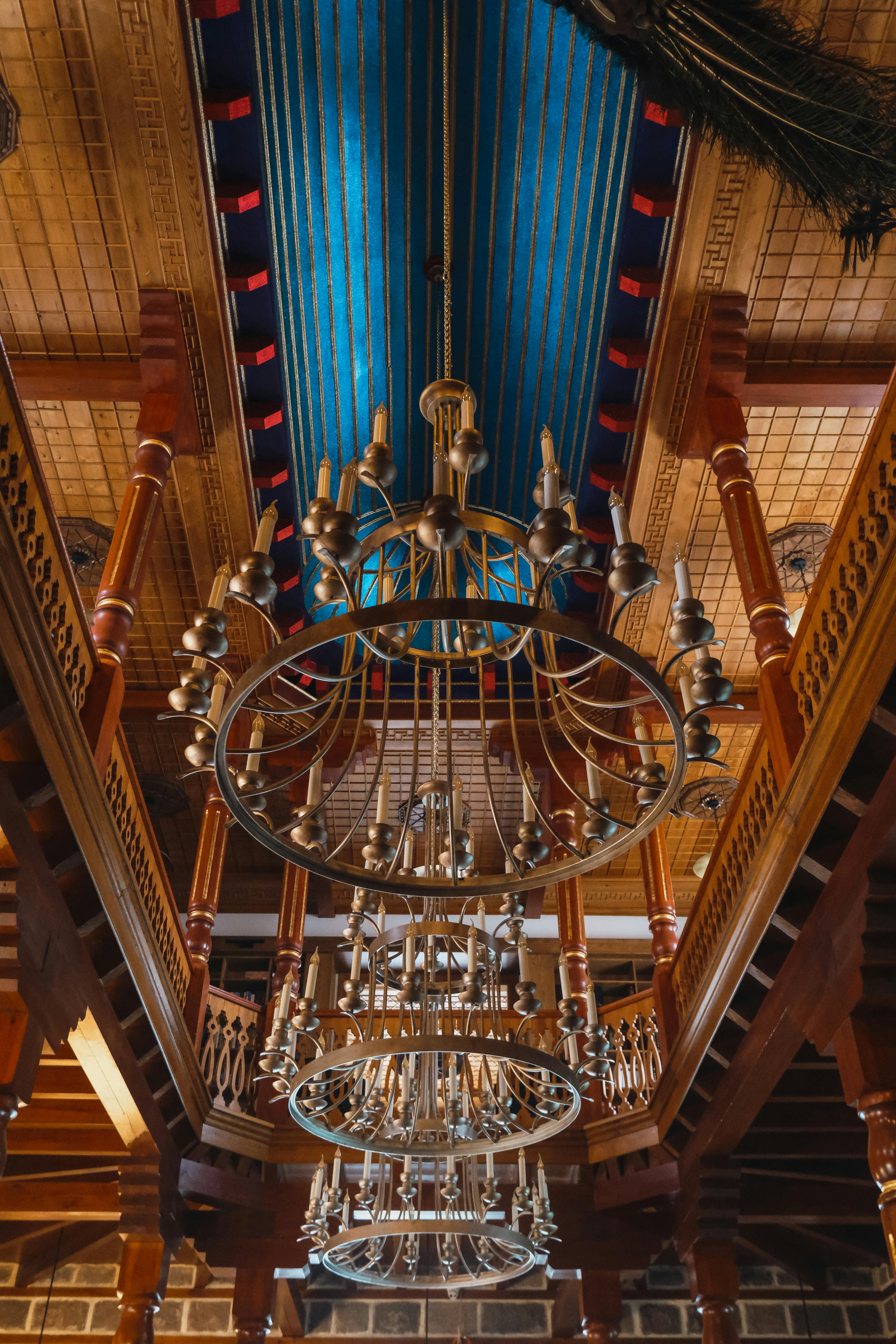 Ornamented Chandeliers under Wooden Railings · Free Stock Photo