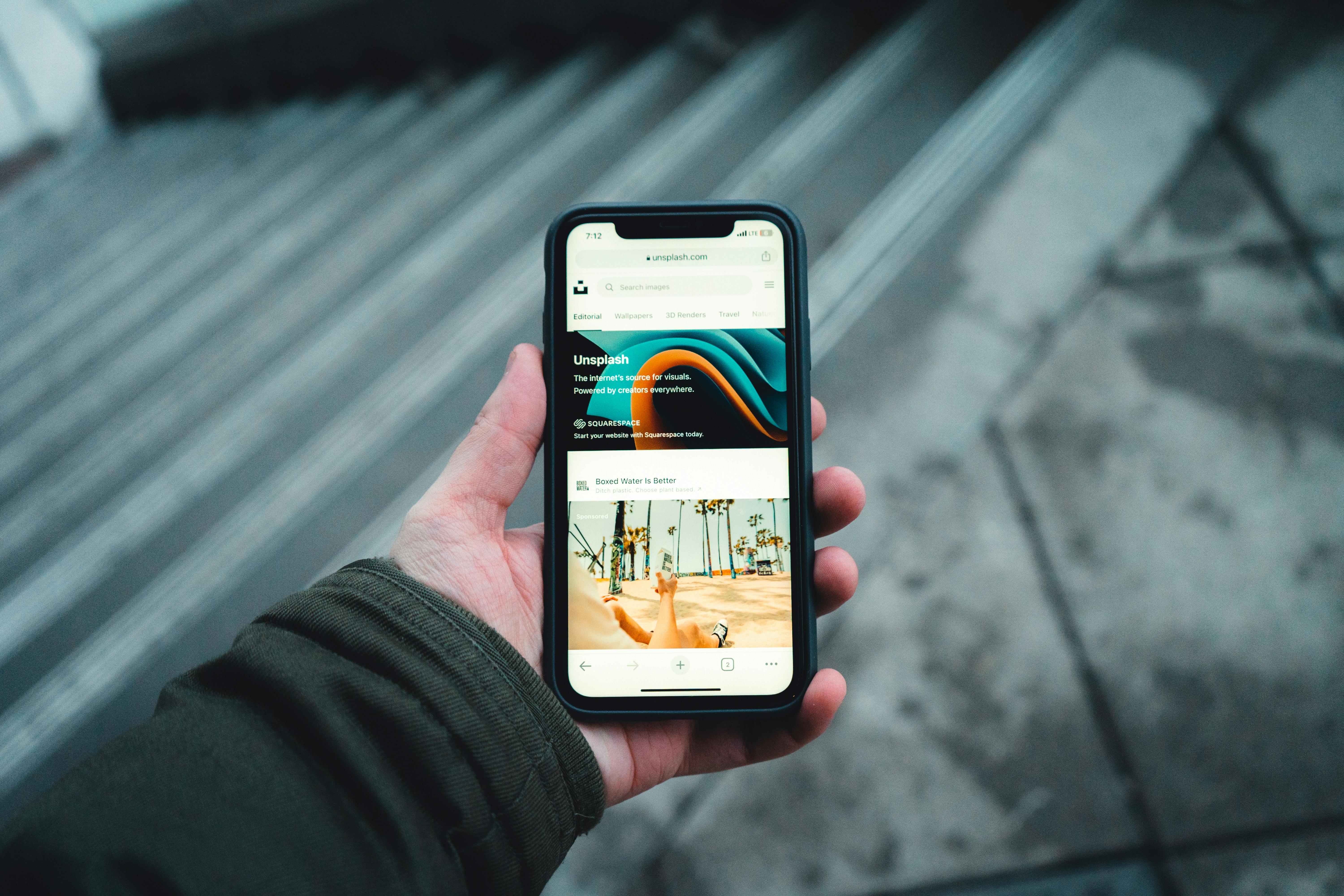 Hand of a Person Using a Smart Phone · Free Stock Photo