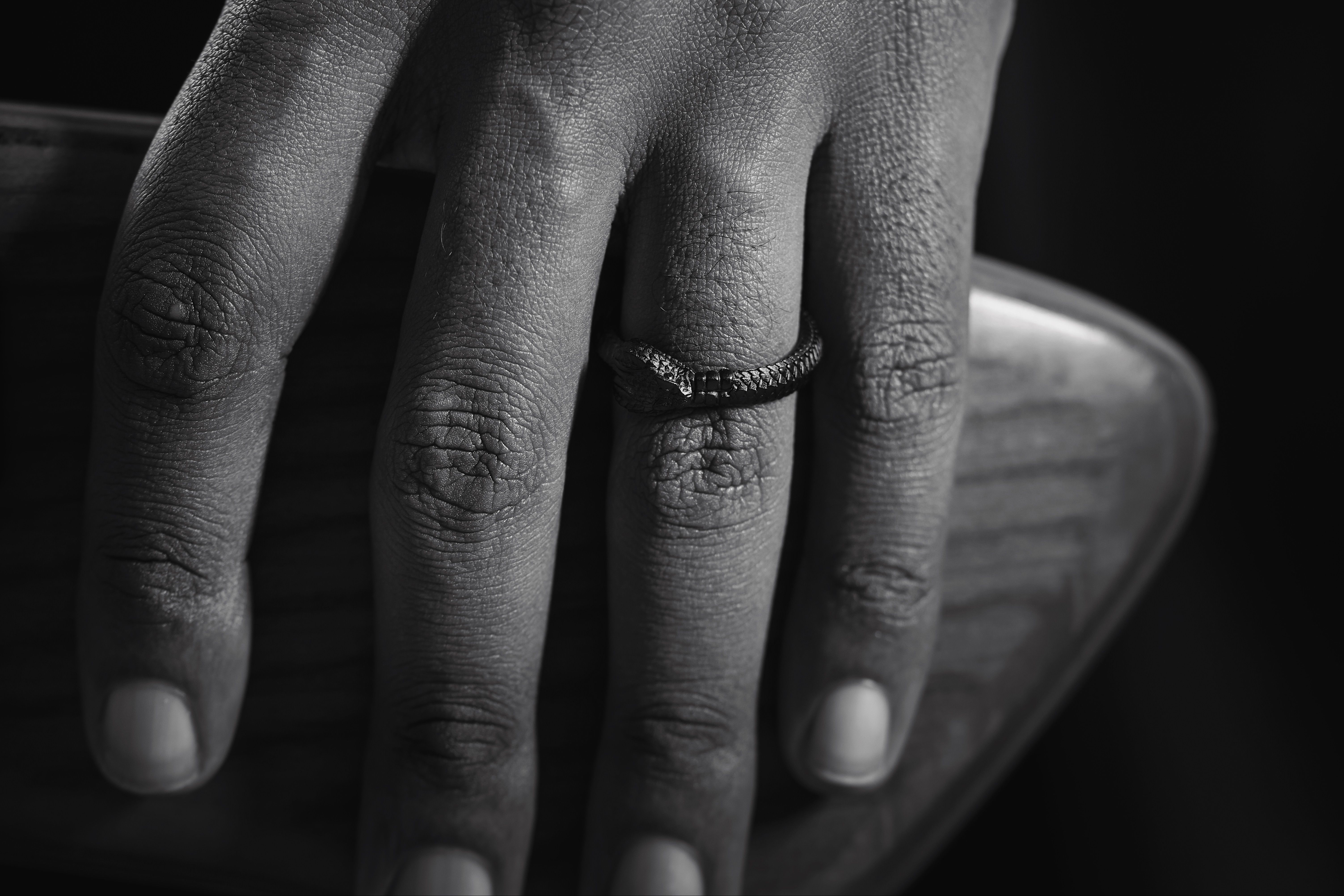Grayscale Photo of Man Grabbing Using Right Hand · Free Stock Photo