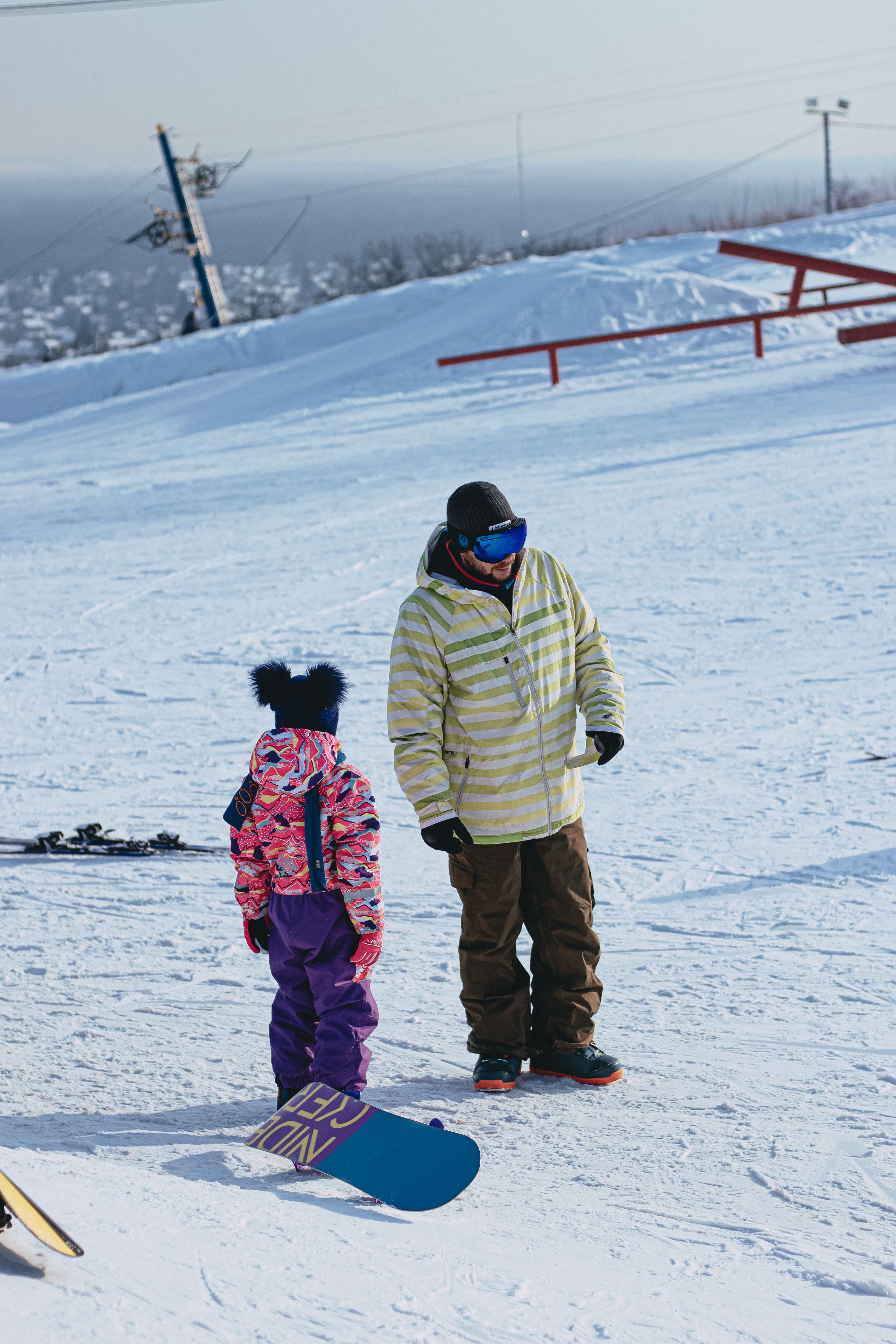 Father and Daughter on Snowboard · Free Stock Photo