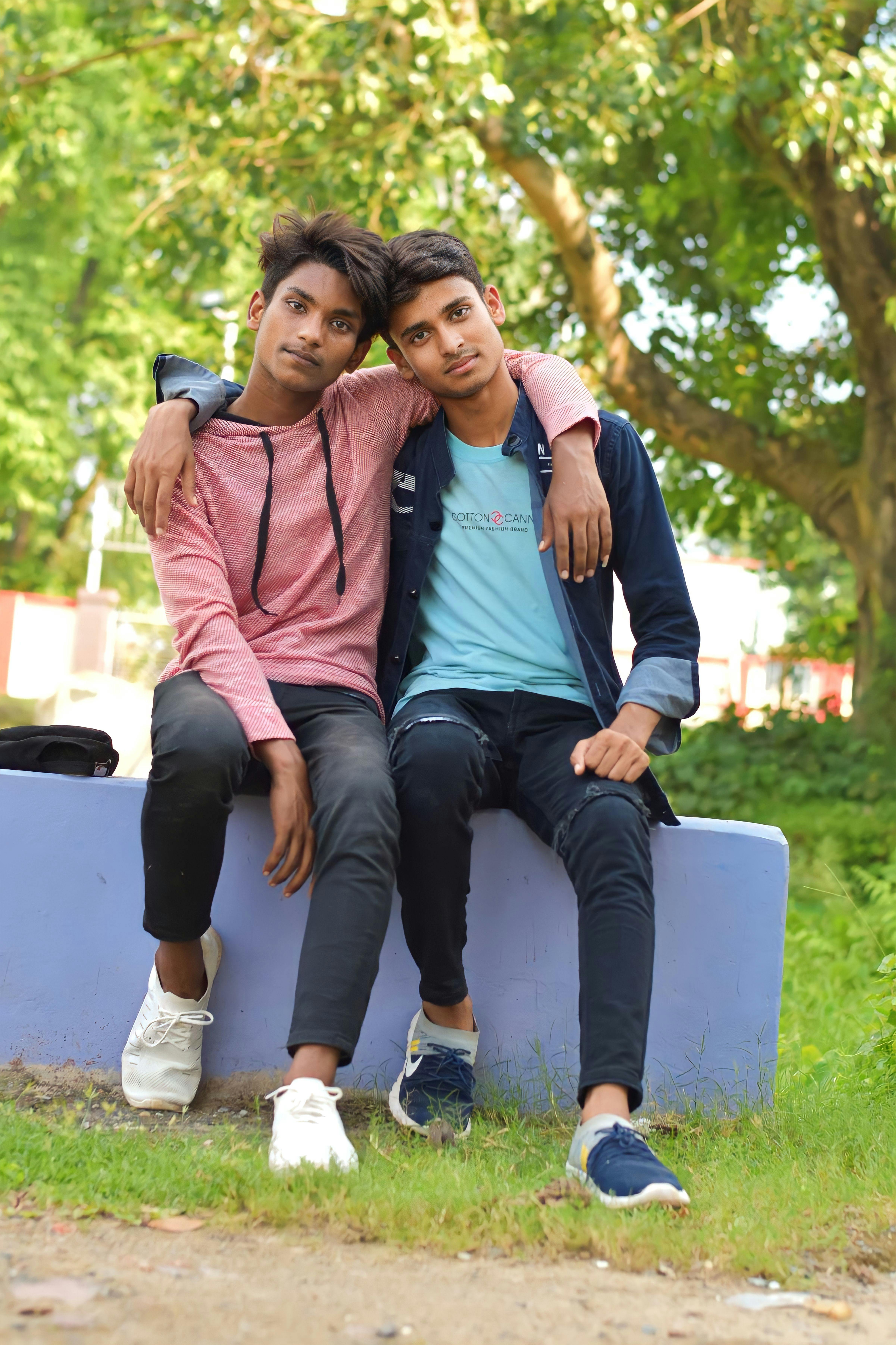 Teenage Boys in Friendly Embrace in a Park · Free Stock Photo