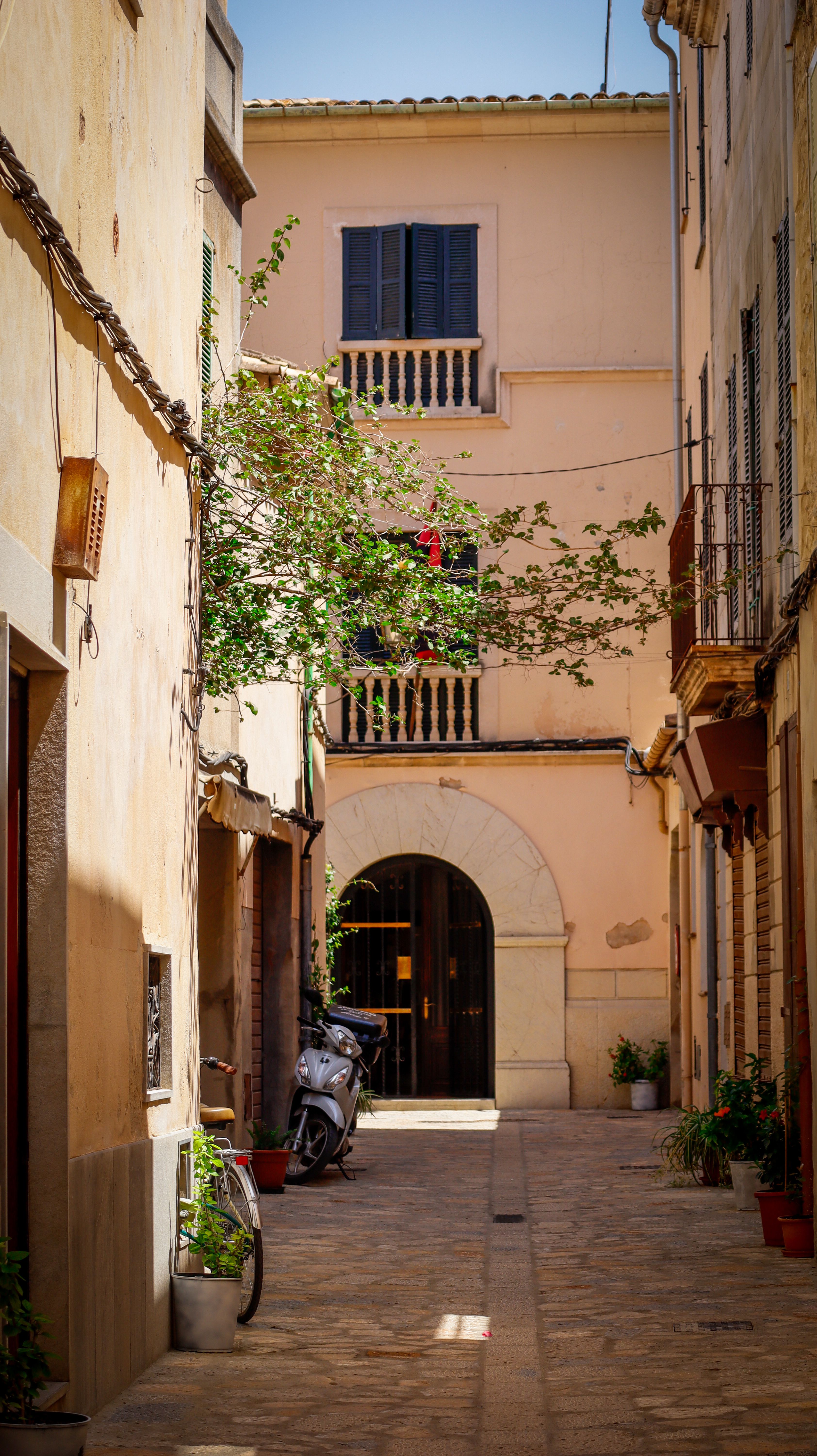 Narrow Cobblestone Alley Between Houses · Free Stock Photo