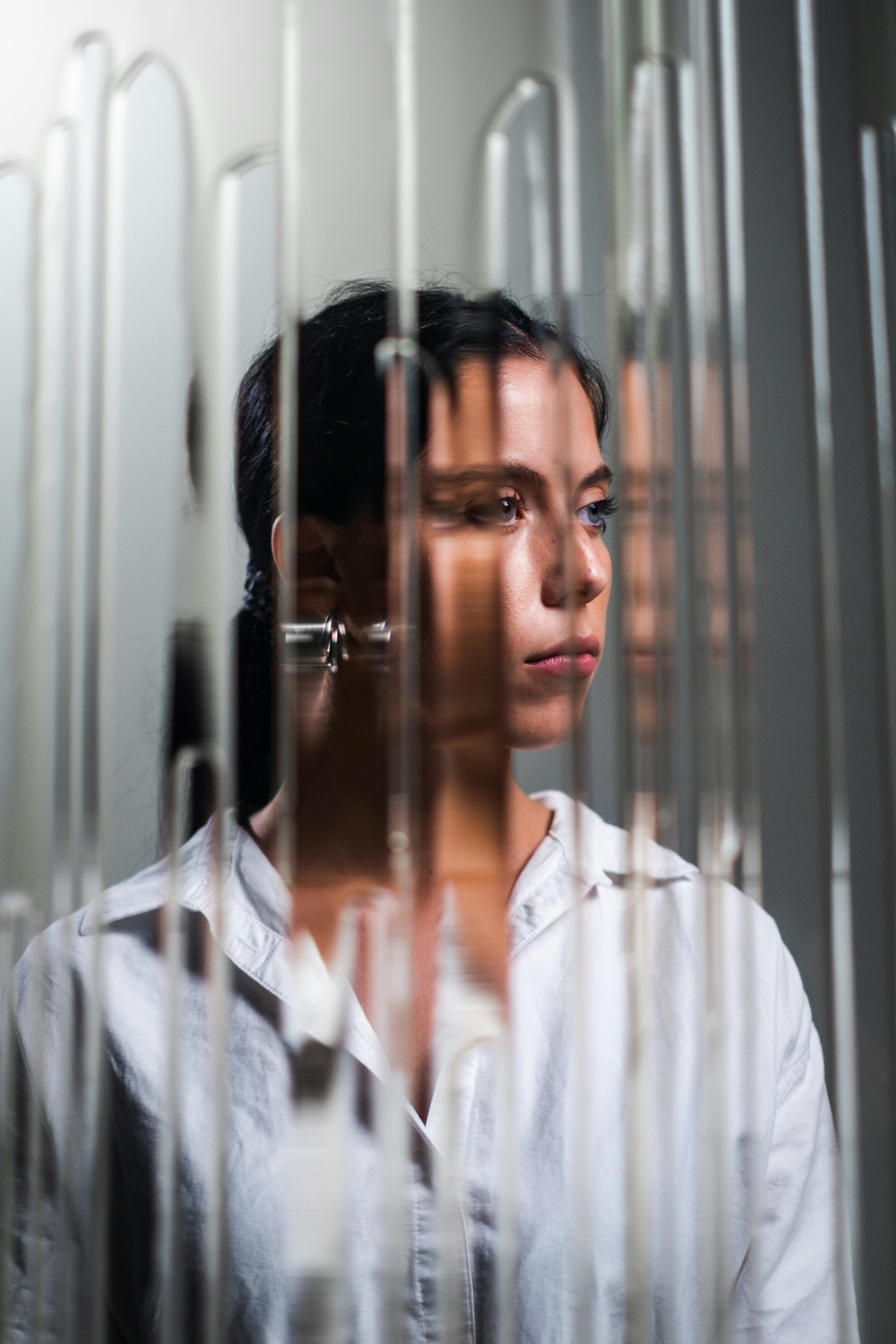 Photo of a Woman behind the Glass · Free Stock Photo