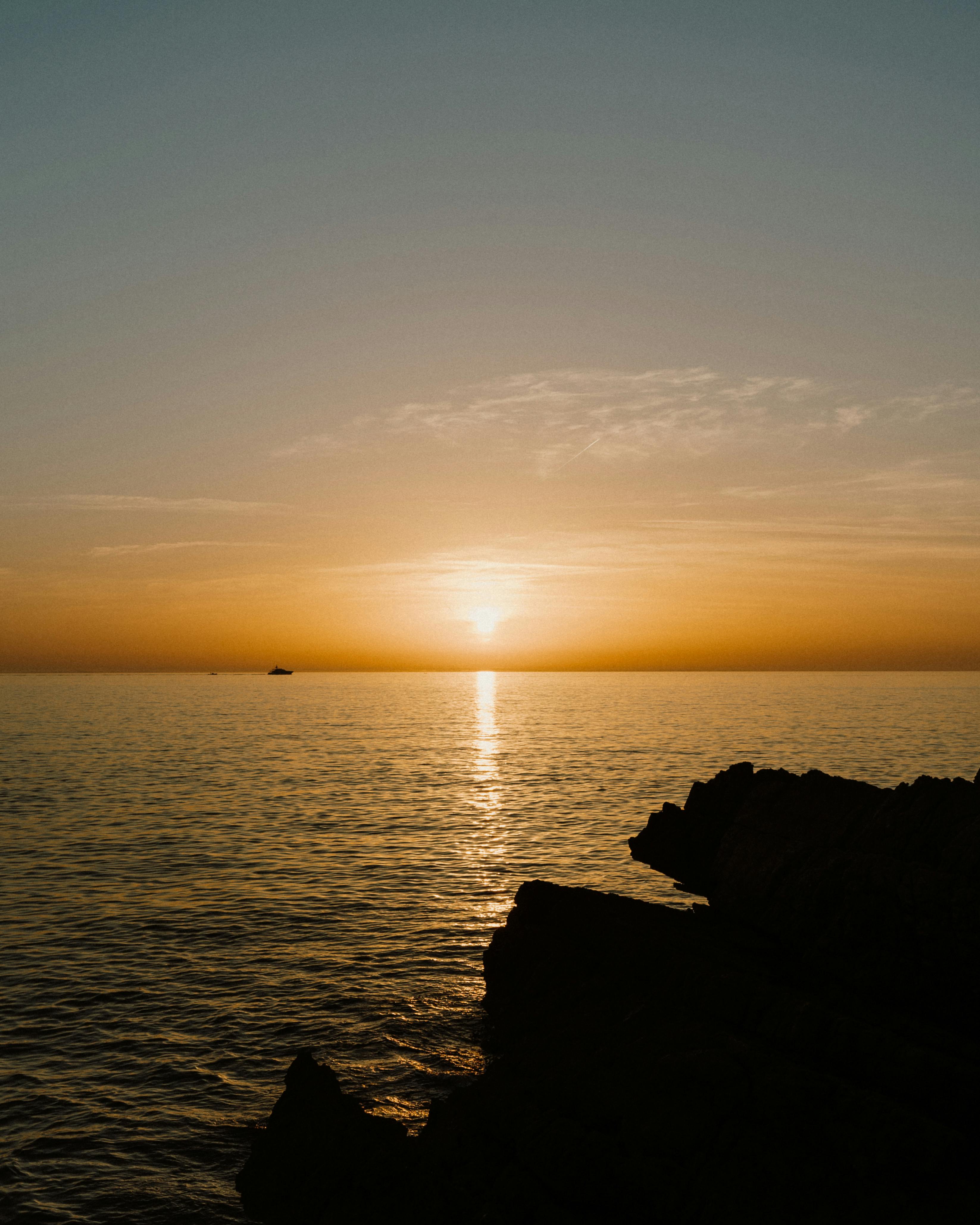 Overcast over Rocks on Sea Shore · Free Stock Photo