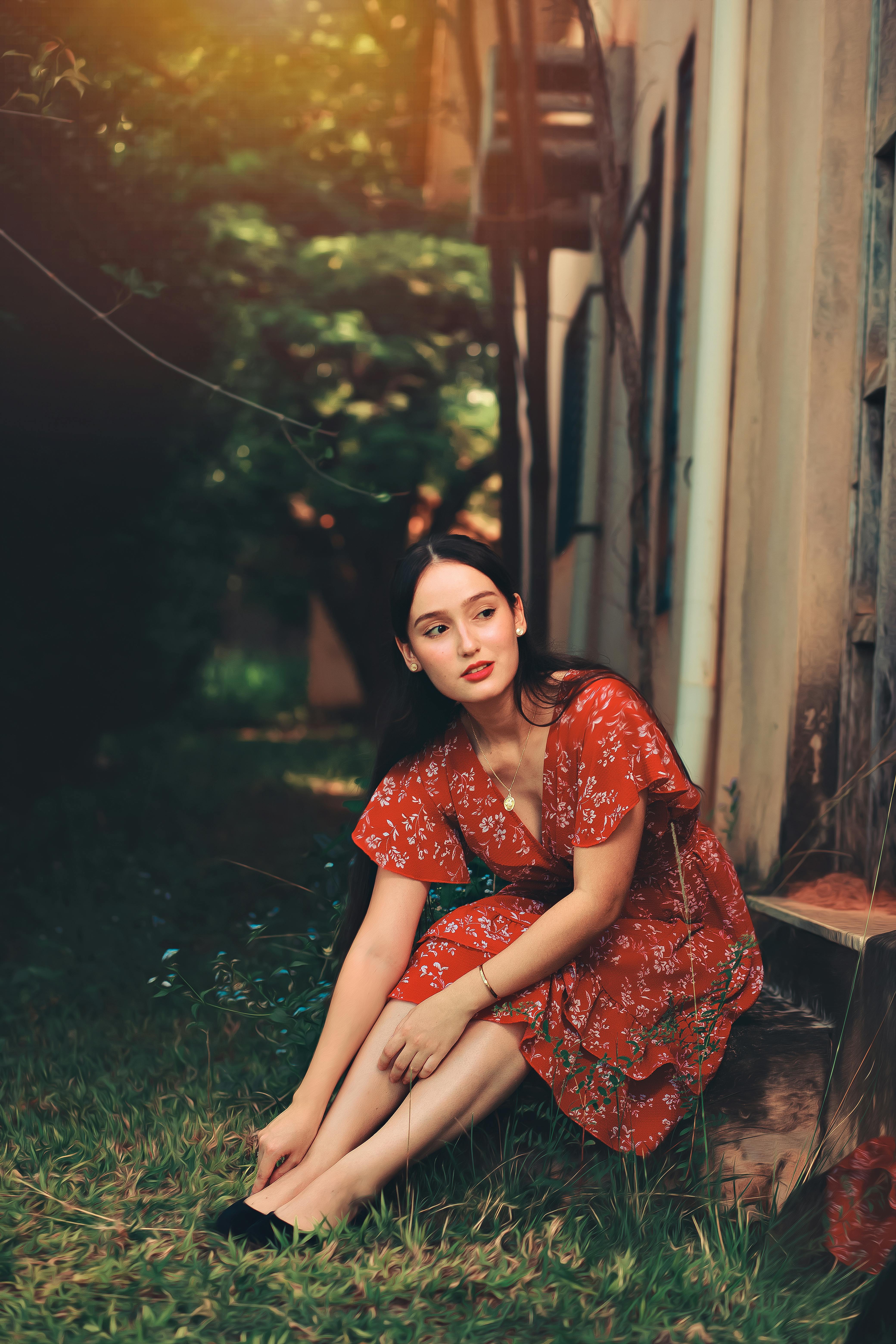 Woman Sitting in Red Dress · Free Stock Photo