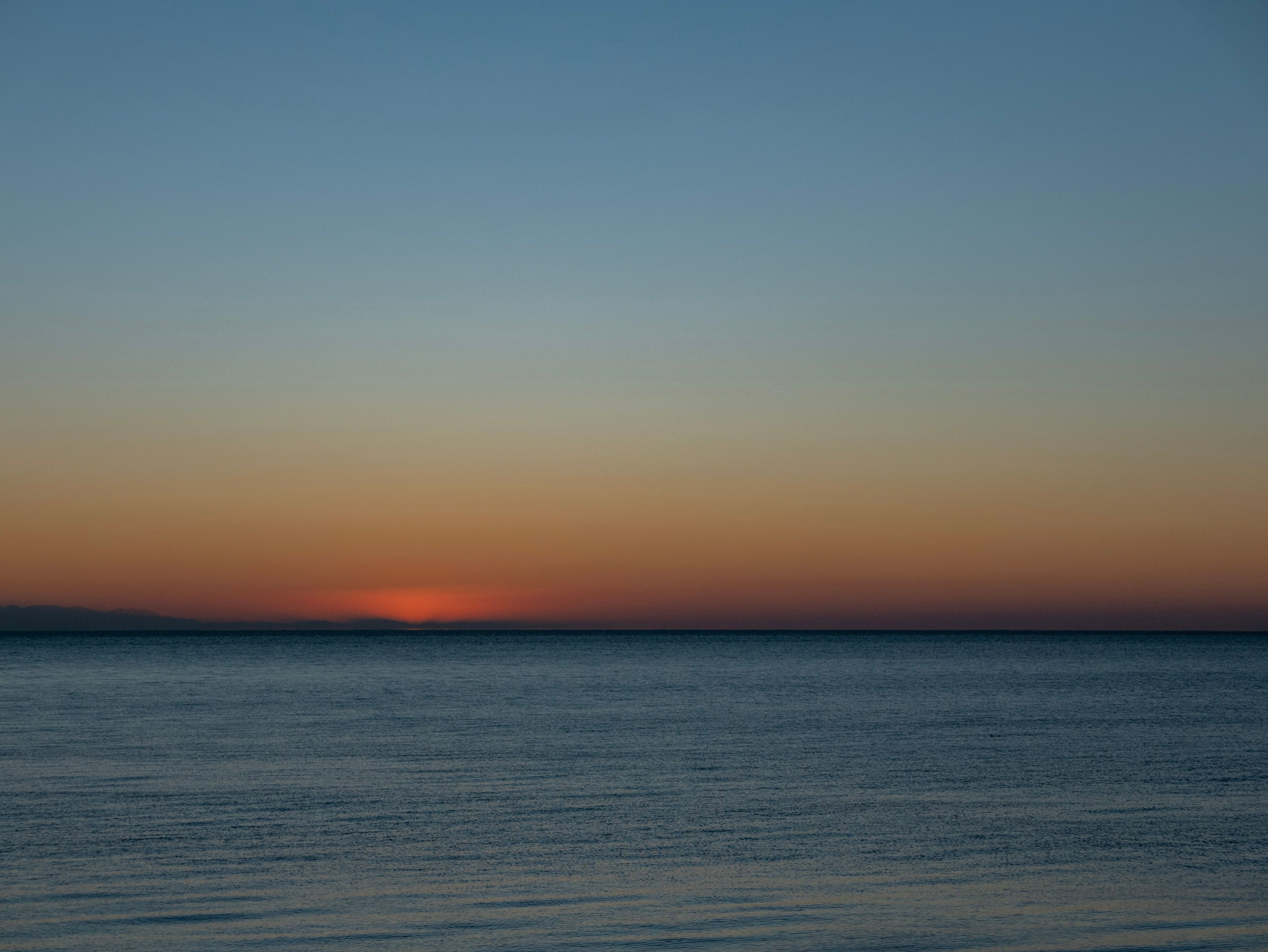 Photo of the Sea at Dusk · Free Stock Photo