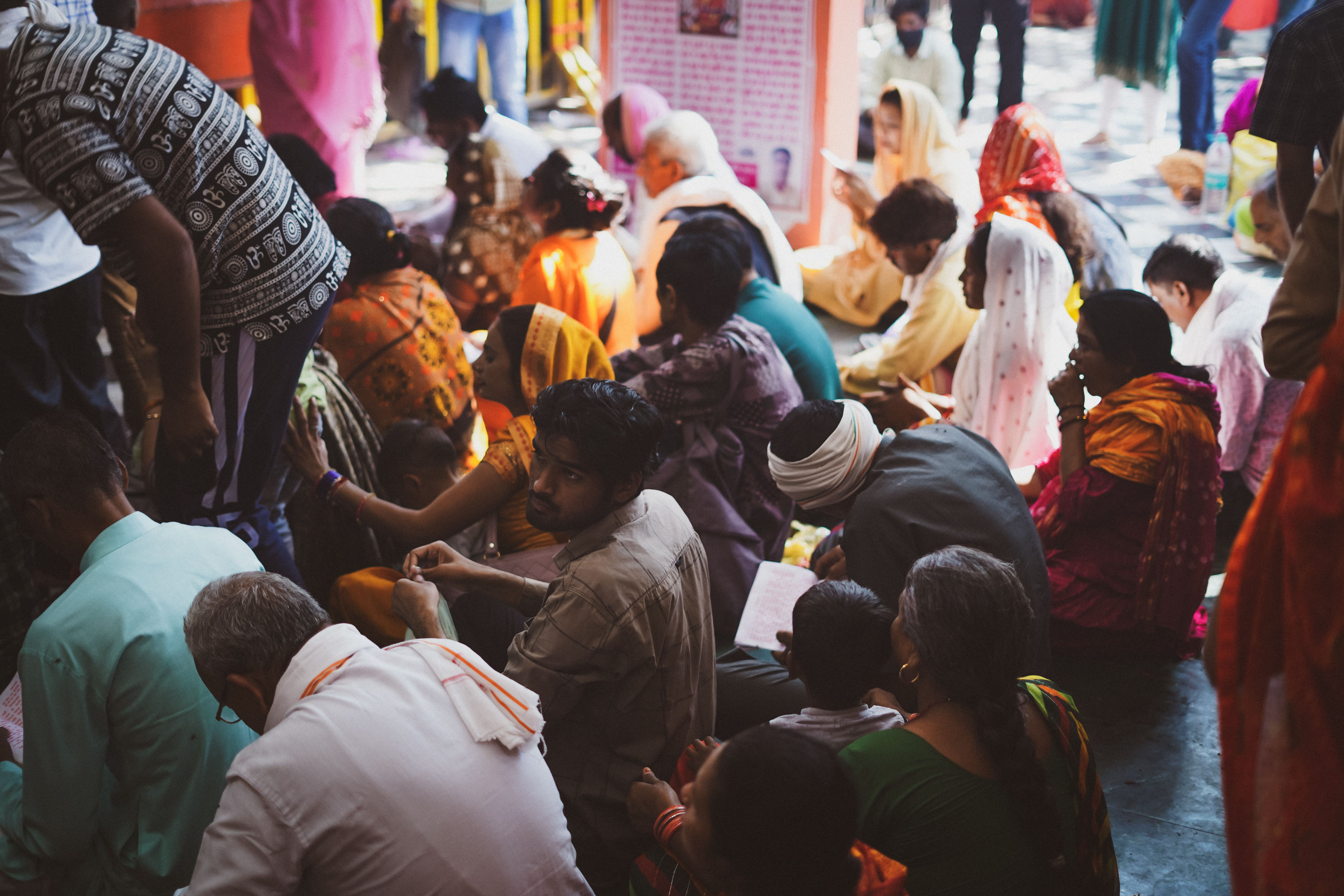 People Sitting on the Ground and Praying · Free Stock Photo