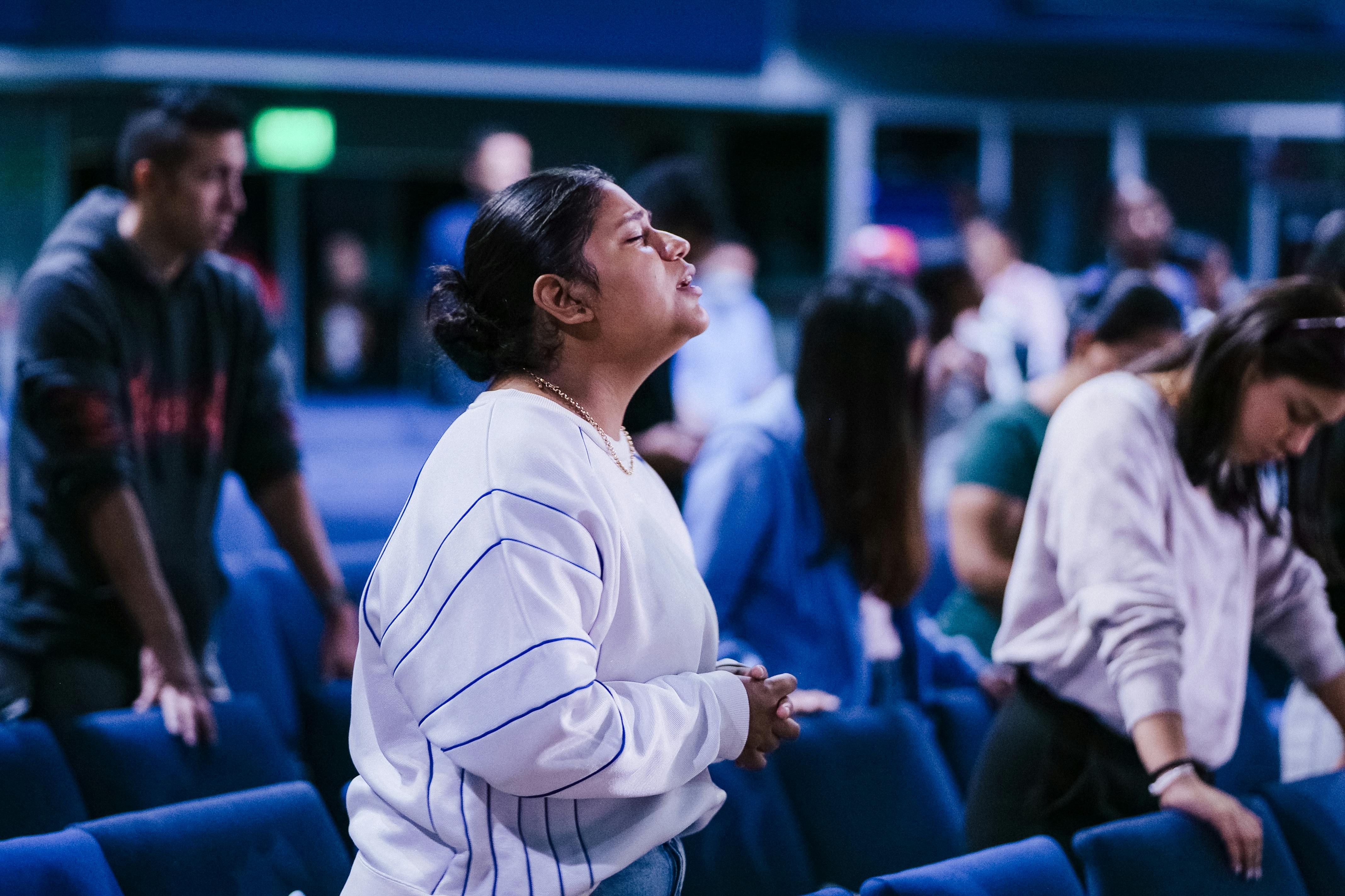 Praying People during Mass · Free Stock Photo