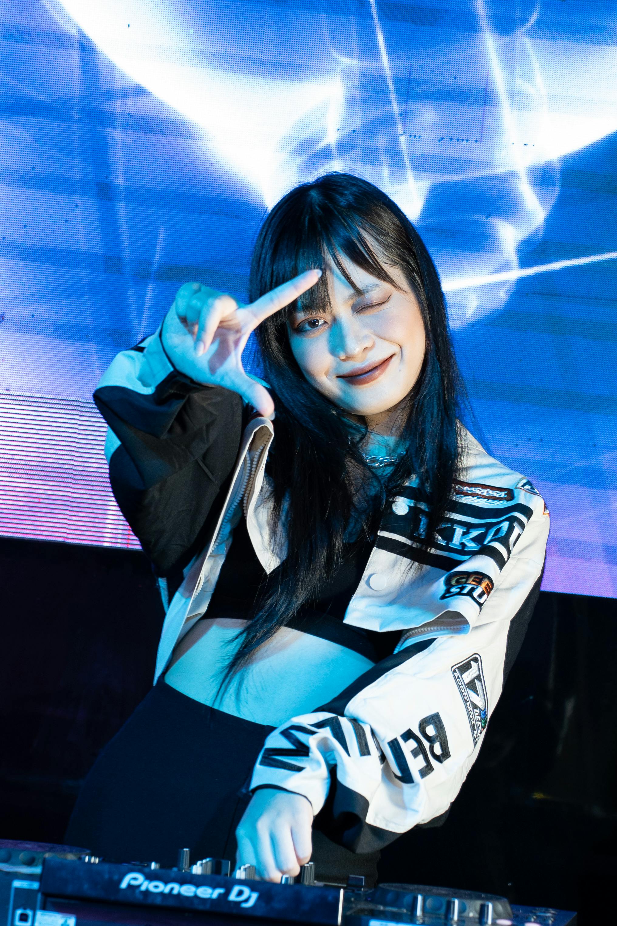 Young Woman DJ Standing behind the Console at a Nightclub Party · Free ...