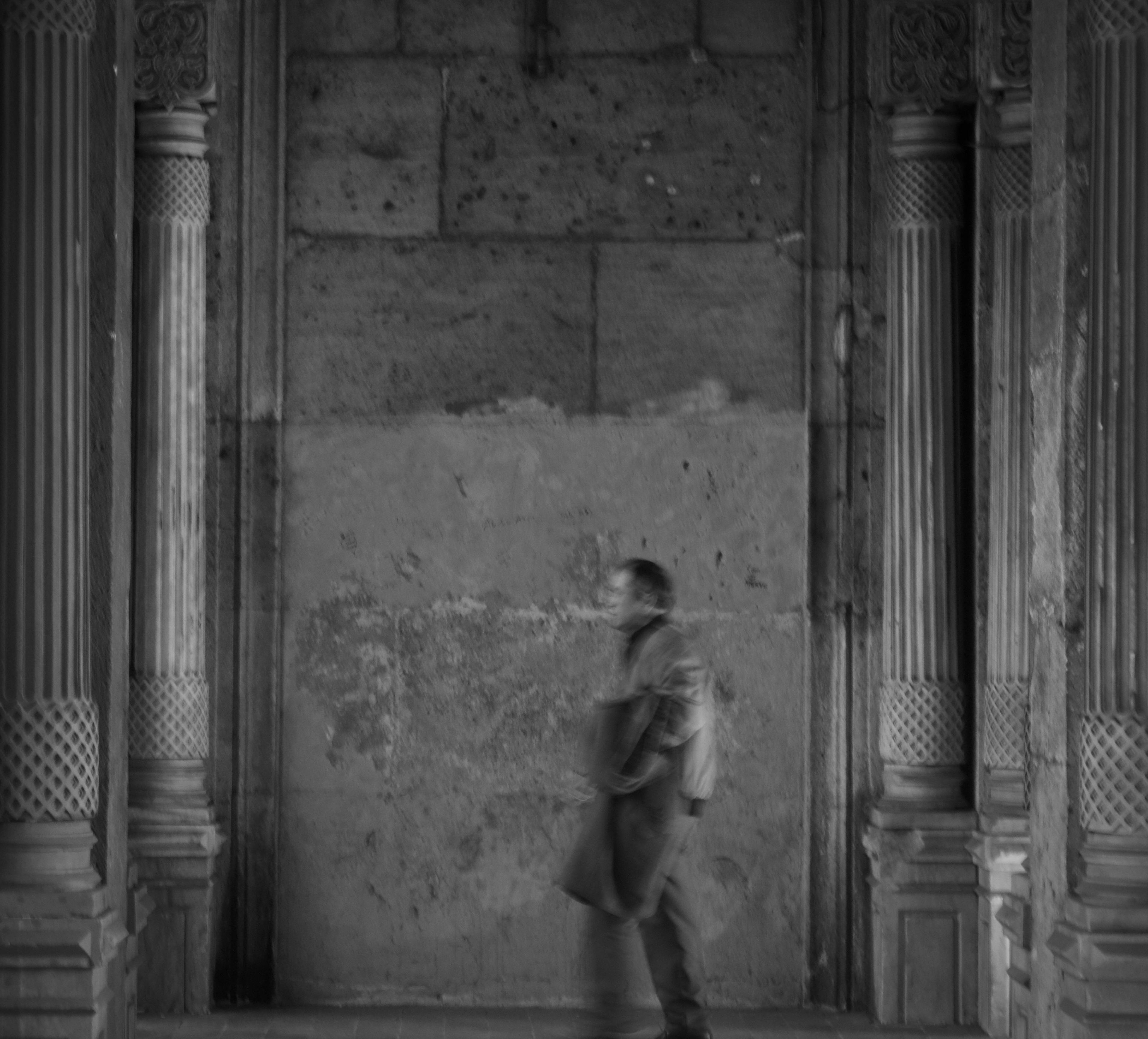 Man Walking between Columns · Free Stock Photo