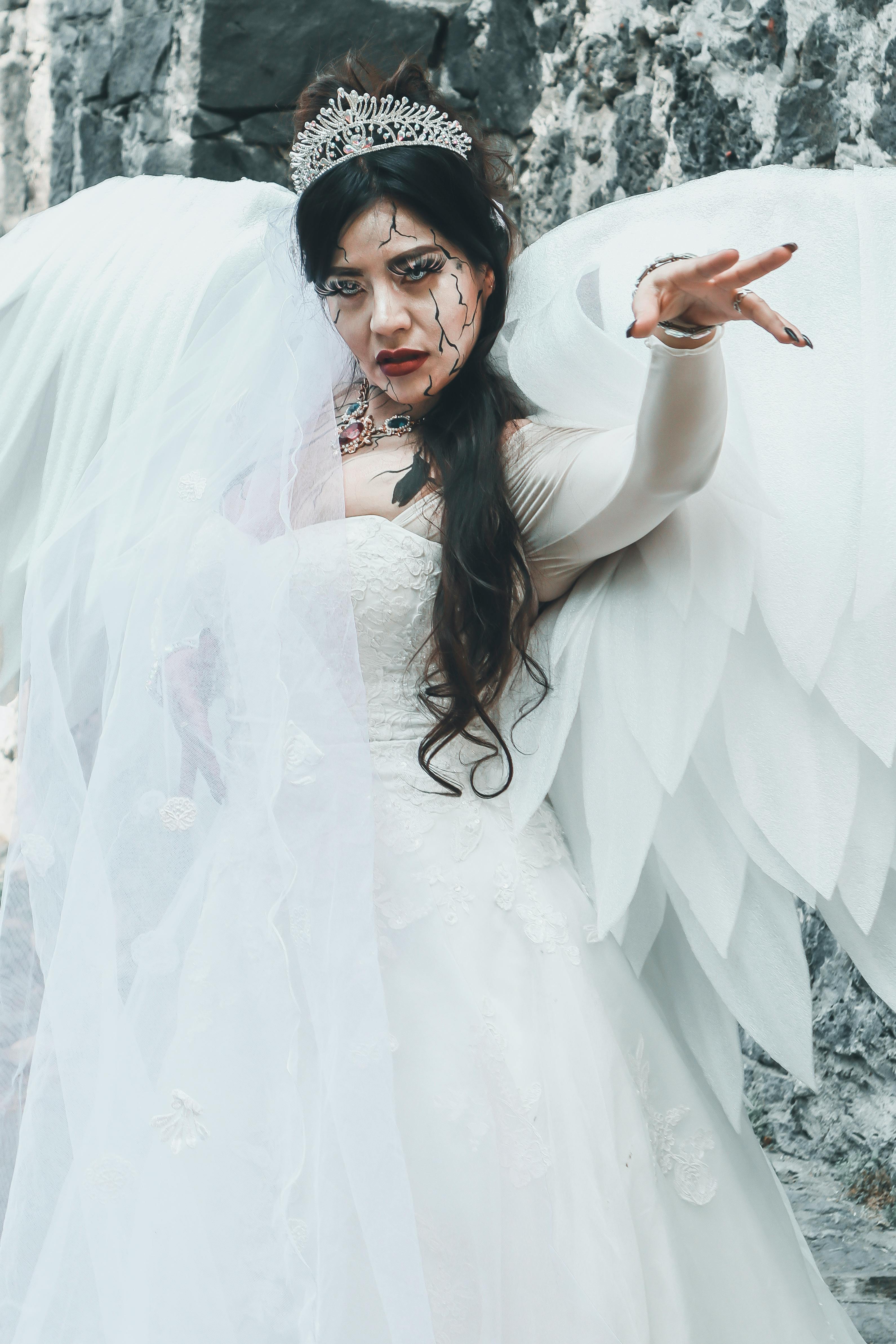 Angel with Cracked Skin Casting a Spell · Free Stock Photo
