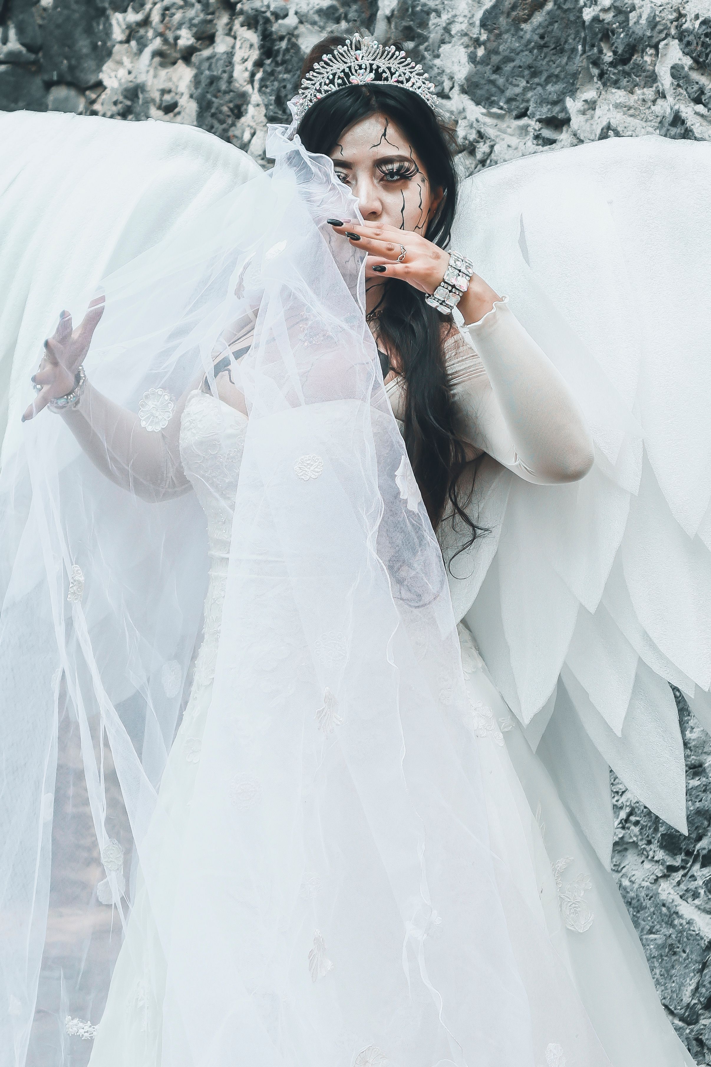 Woman in Angel Costume Overlooking Cityscape at Sunset · Free Stock Photo