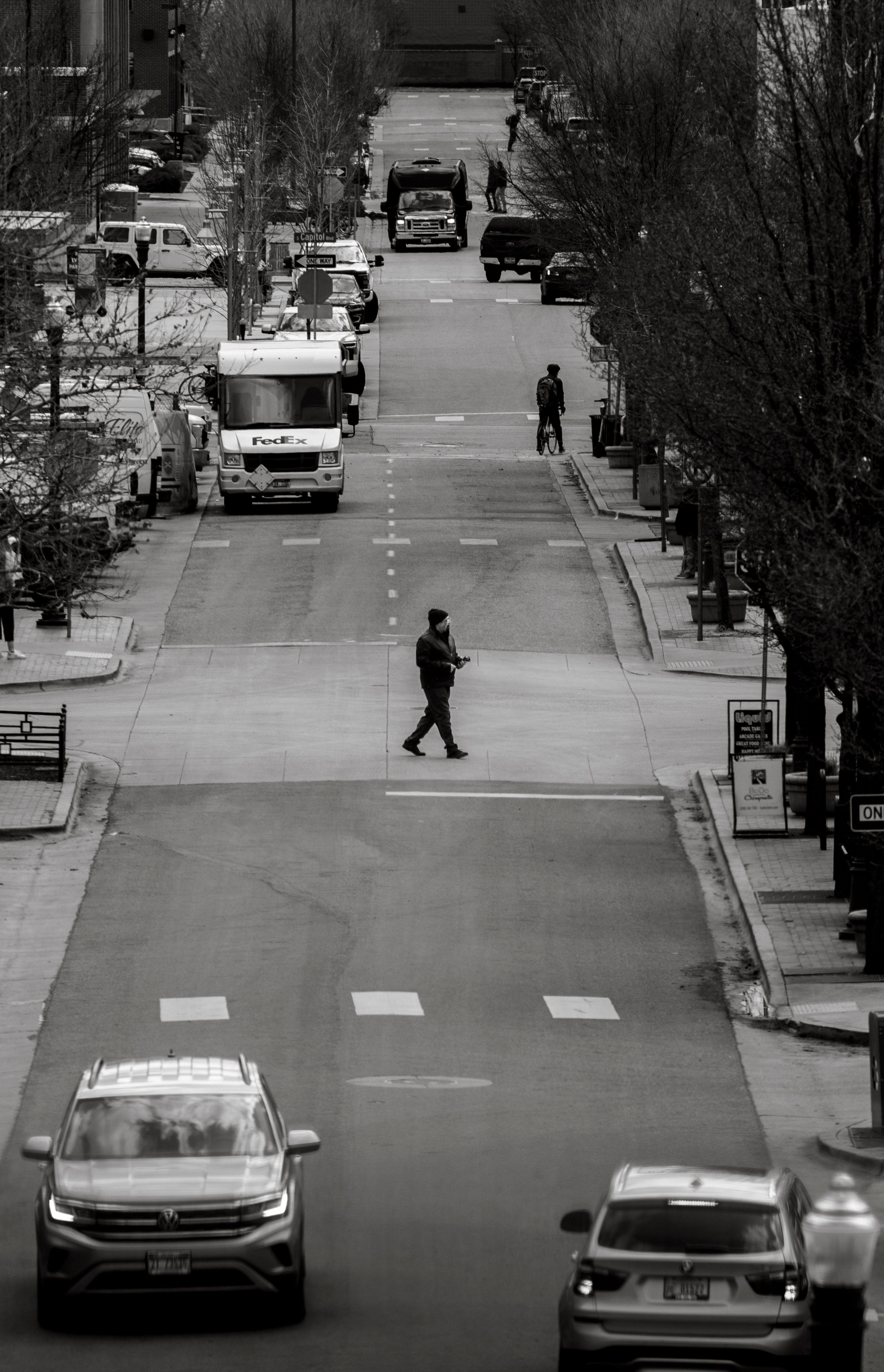 Passerby Walking Through an Intersection · Free Stock Photo