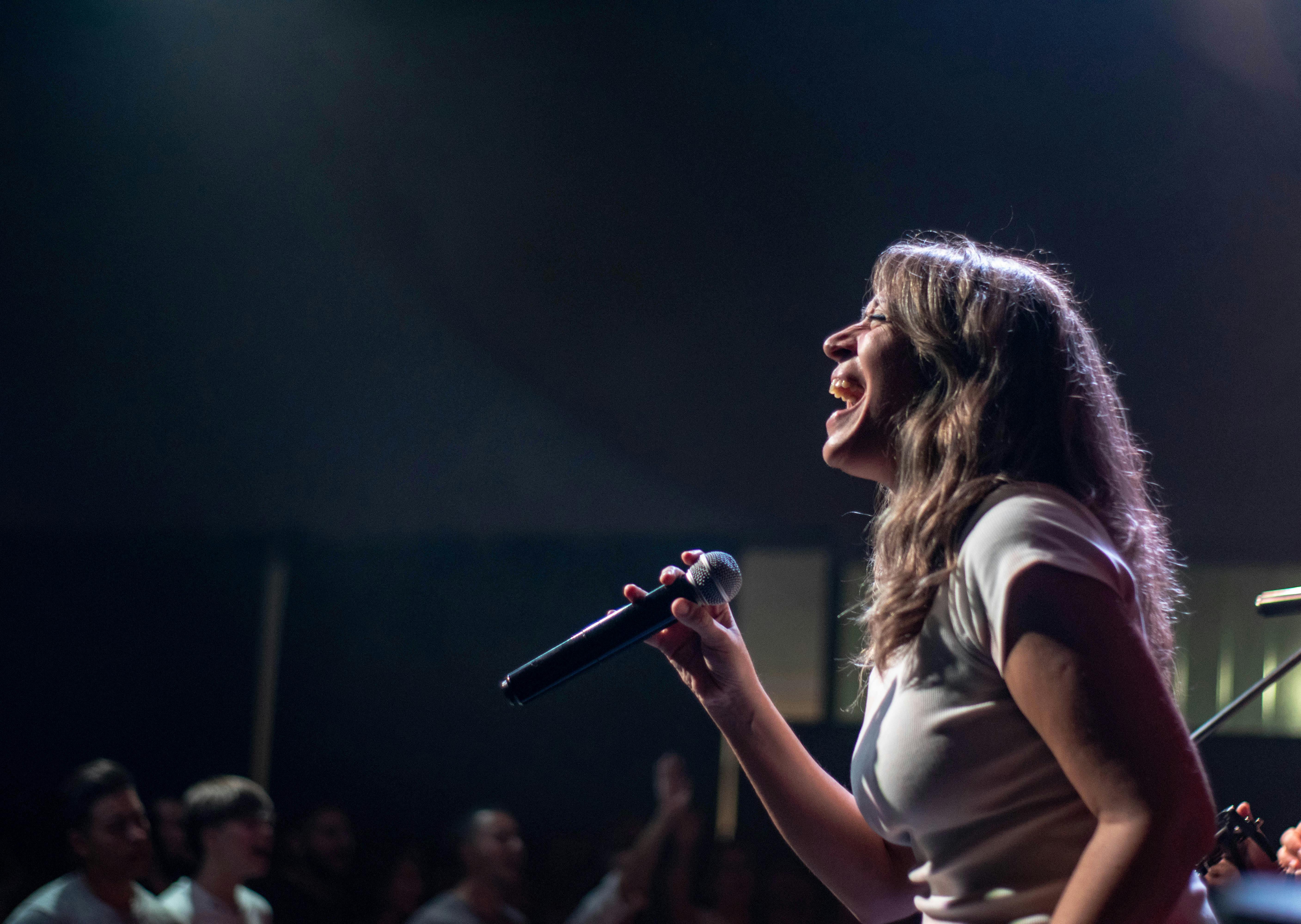 Blonde Woman Singing on Stage · Free Stock Photo