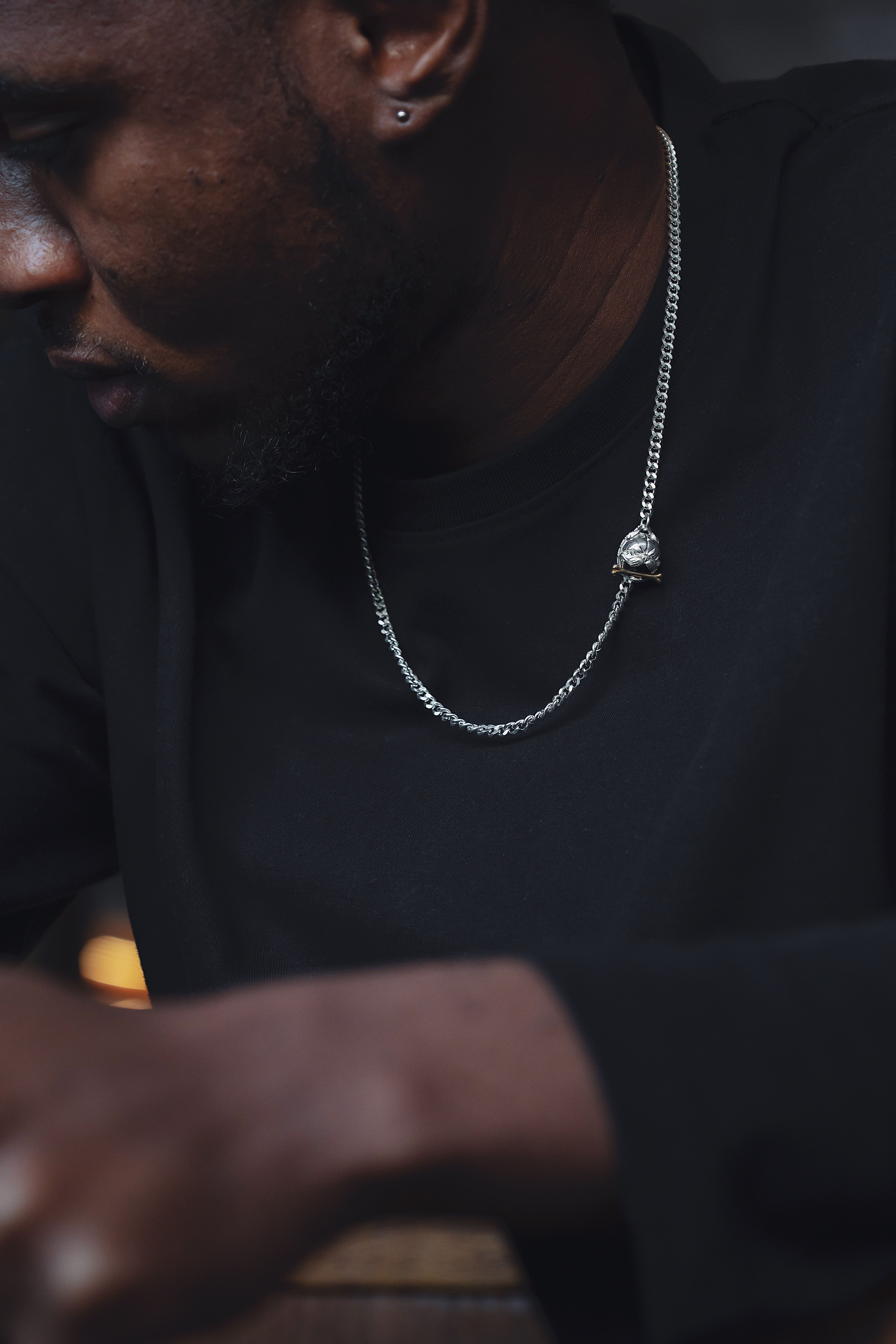Man Posing Wearing a Silver Cuban Link Chain with a Handmade Pendant ...