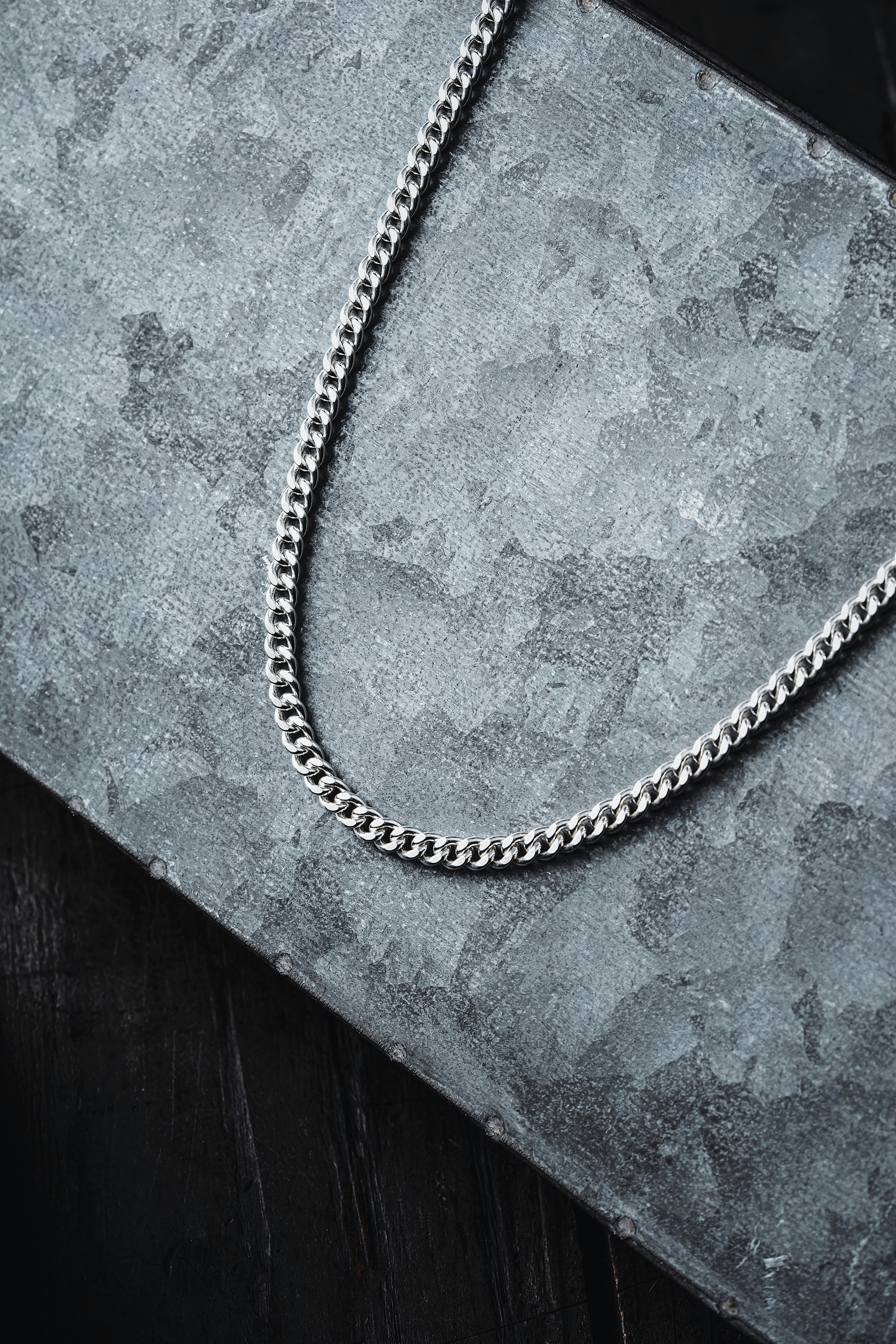 Silver Chain on Marble · Free Stock Photo