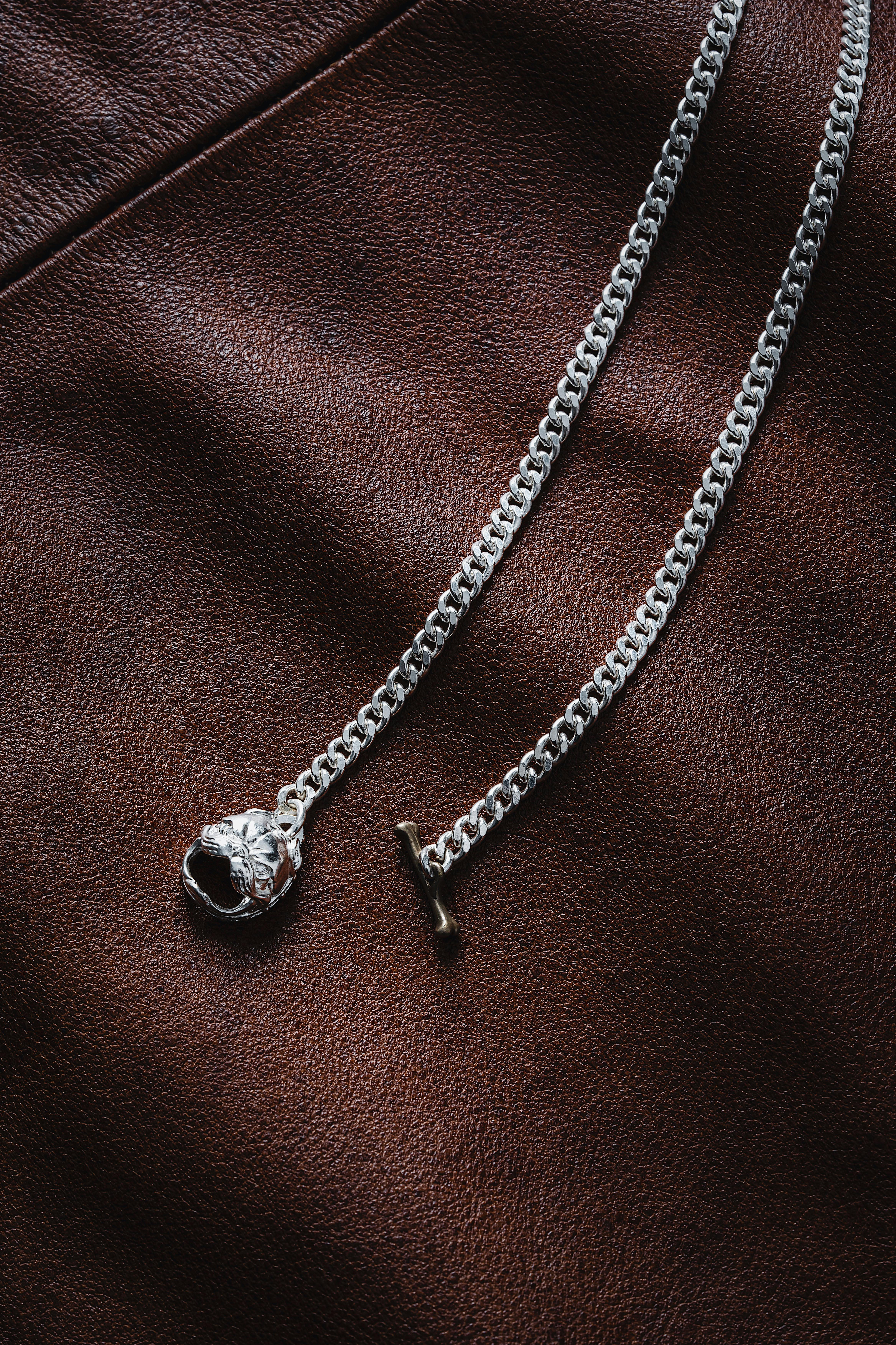 Silver Chain on Leather Texture · Free Stock Photo