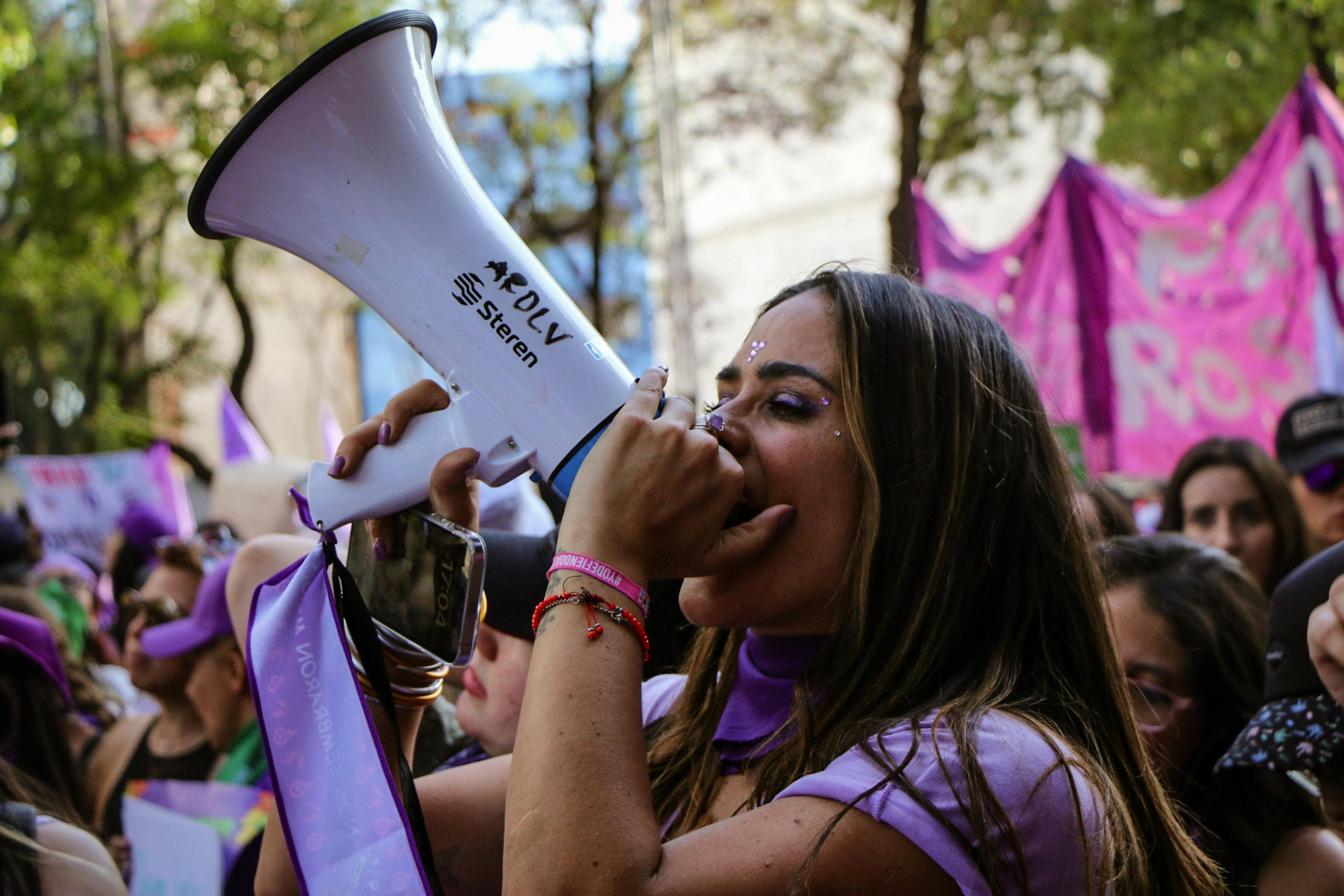 Woman Screaming through a Loudspeaker at a Demonstration · Free Stock Photo