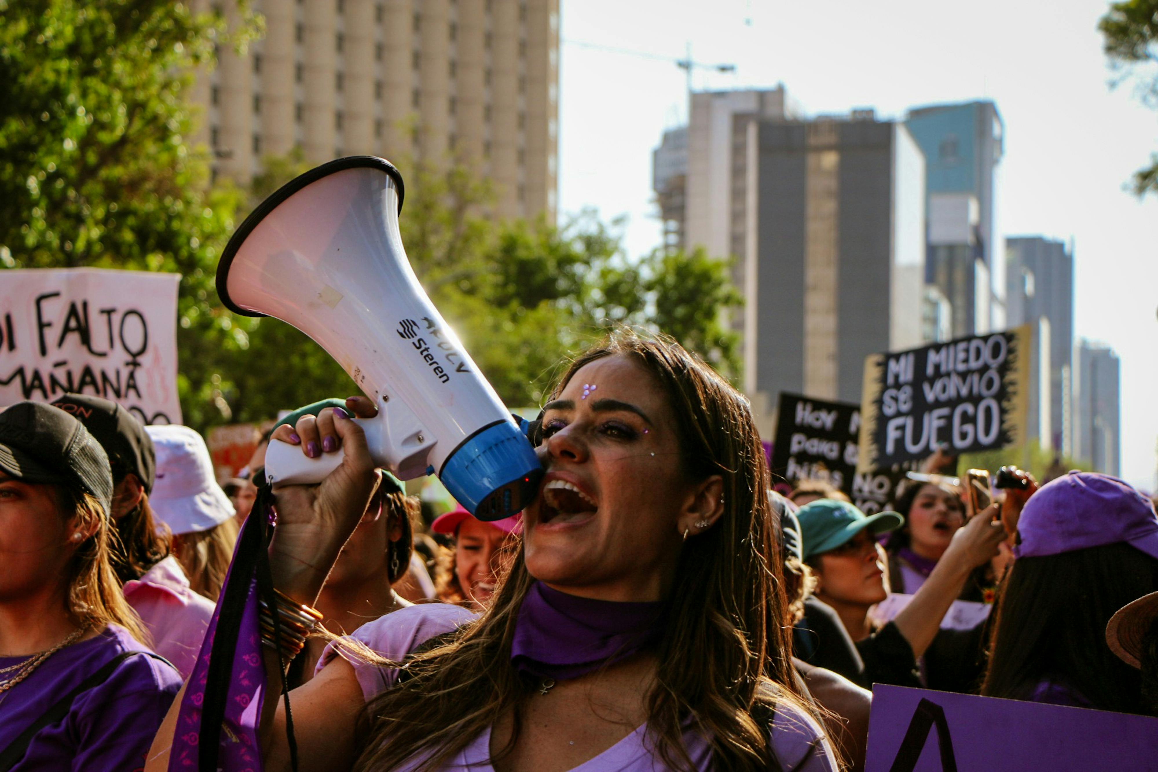 Woman Screaming through a Loudspeaker at a Demonstration · Free Stock Photo